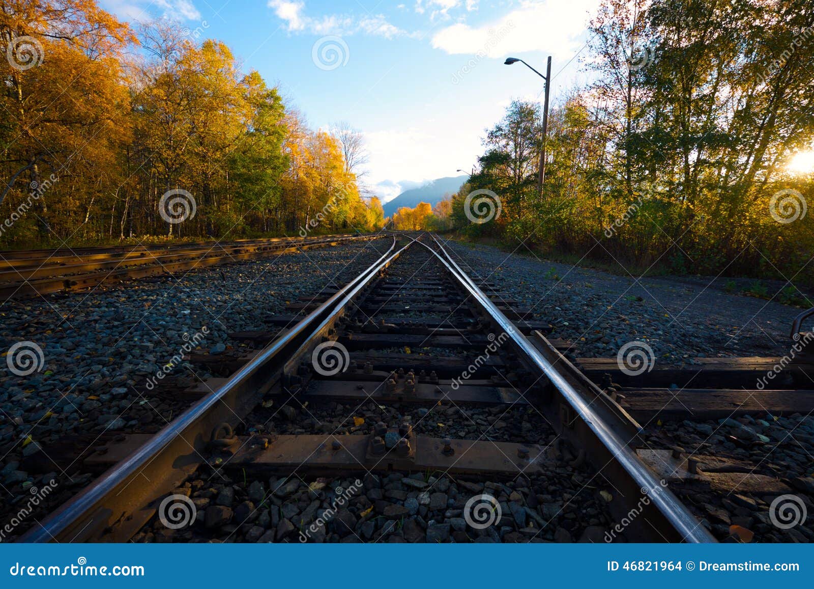 Diverging Train Tracks With Wild West Mountains In Background Stock ...
