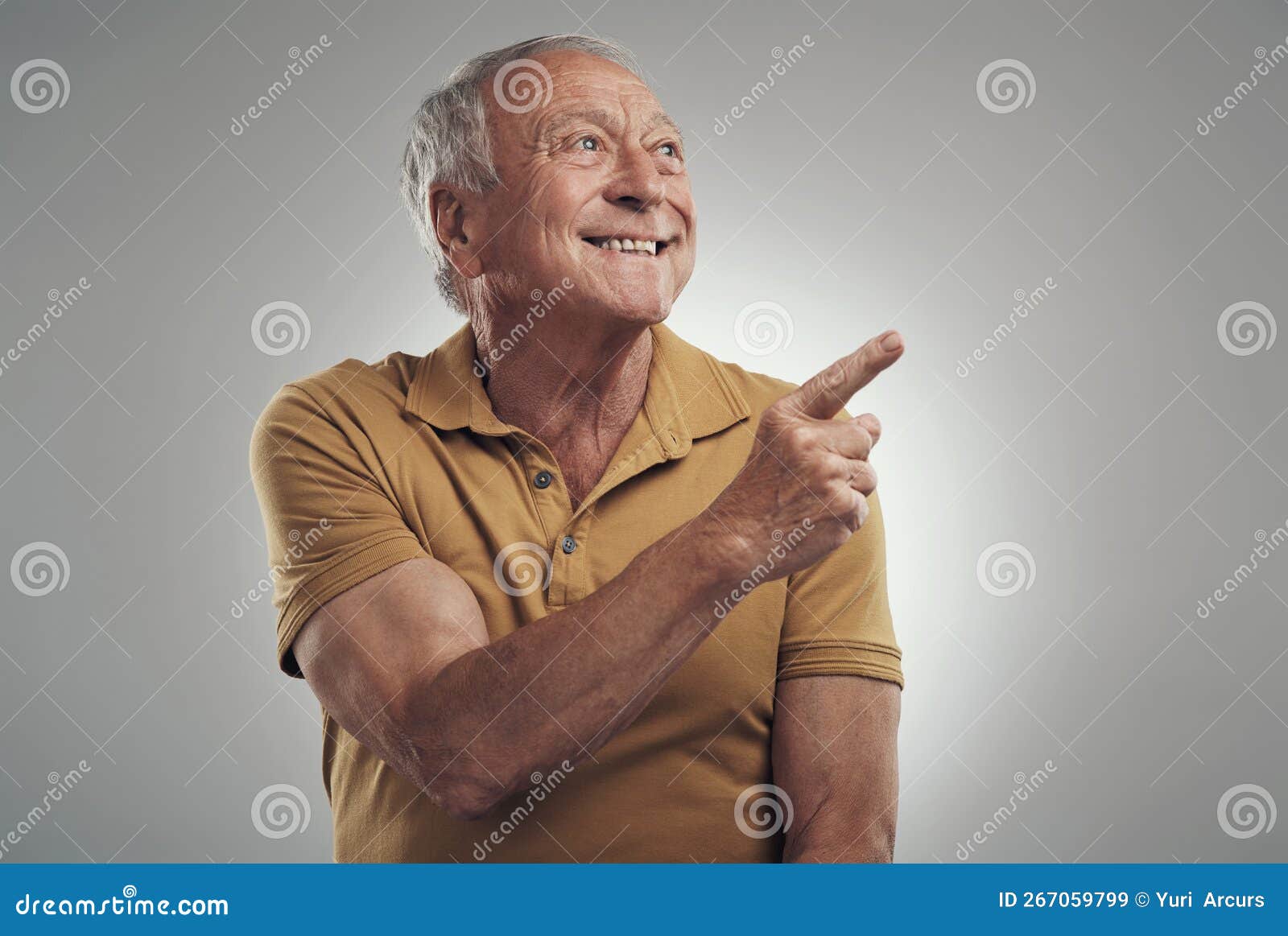 Which Way To the Nearest Exit. Studio Shot of an Elderly Man Pointing ...