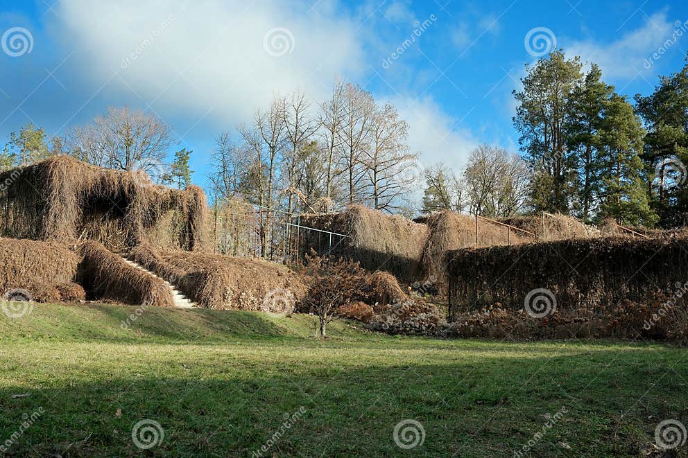 Whimsical Structures Blend into Nature in Serene Landscape Stock Photo ...