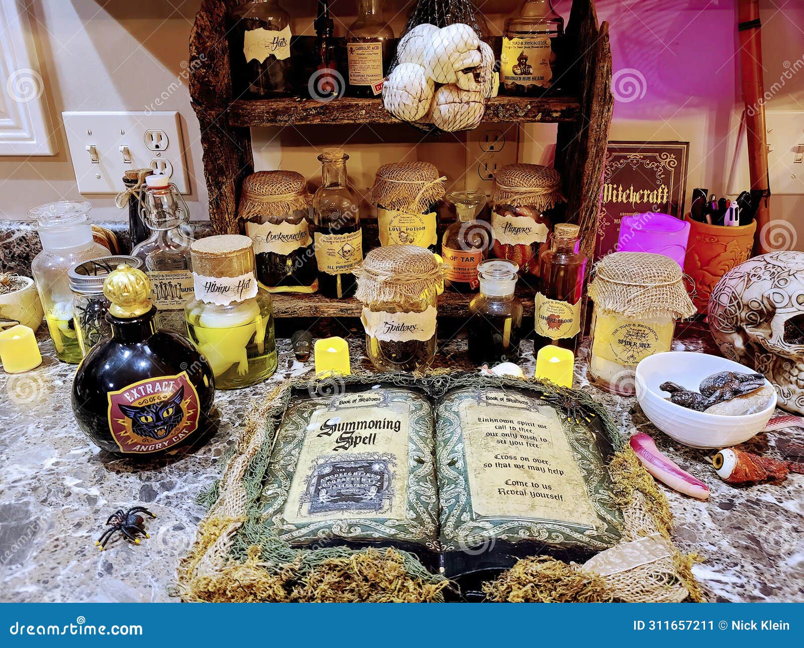 Whimsical Witchcraft Potion Display with Spell Book and Halloween Props ...