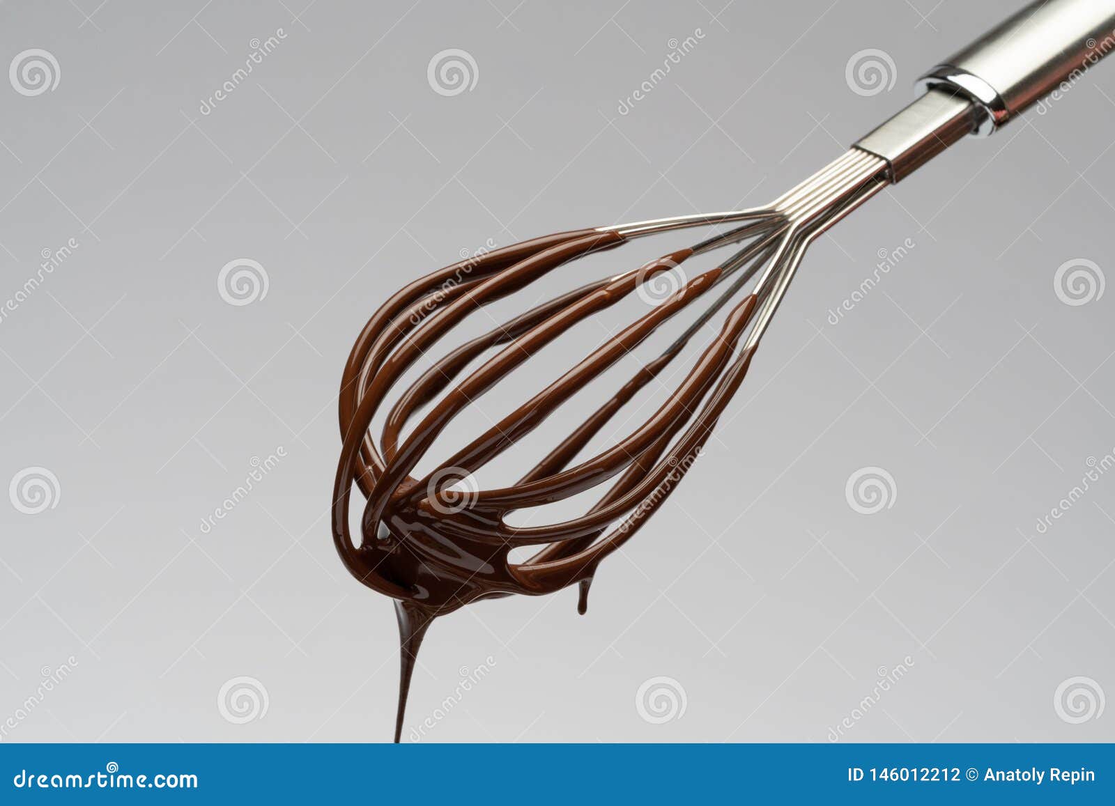 Whisk with Liquid Melted Chocolate on Light Grey Background Stock Photo ...
