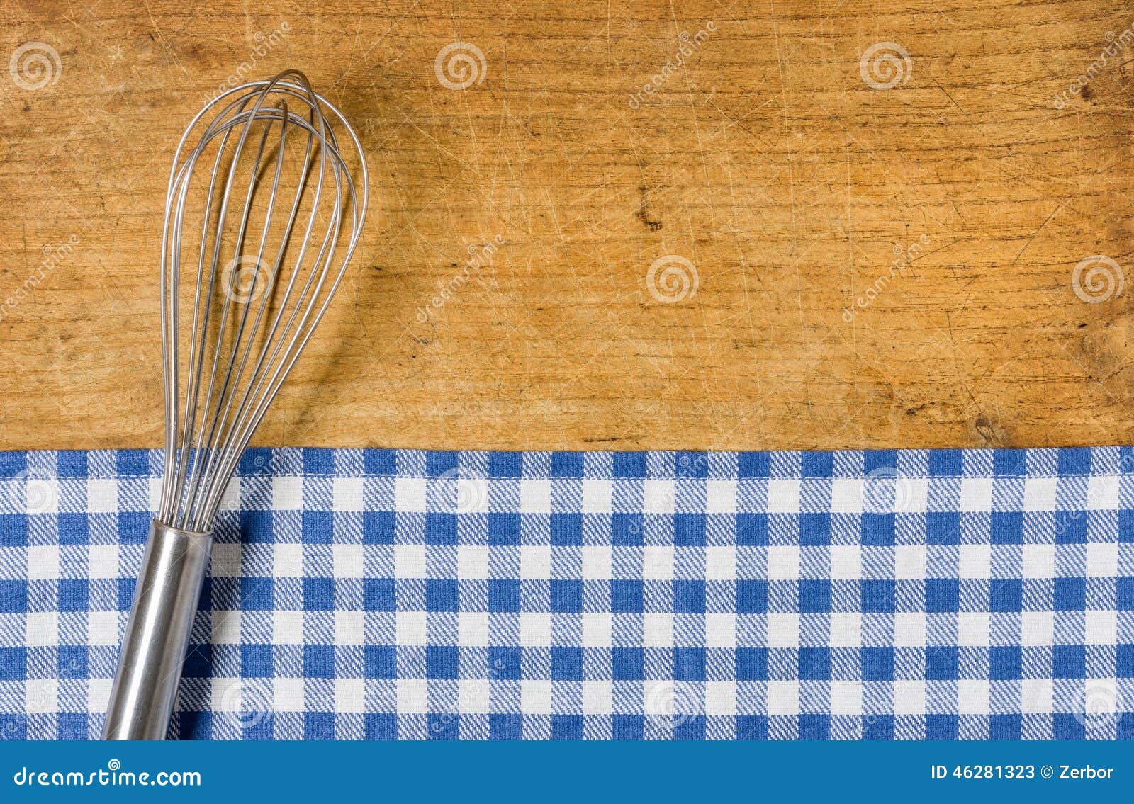Whisk on Wooden Background with a Blue Checkered Tablecloth Stock Image ...