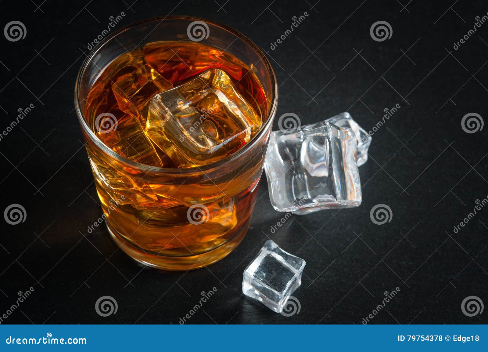 Whiskey with ice cubes stock photo. Image of liquid, cube - 79754378