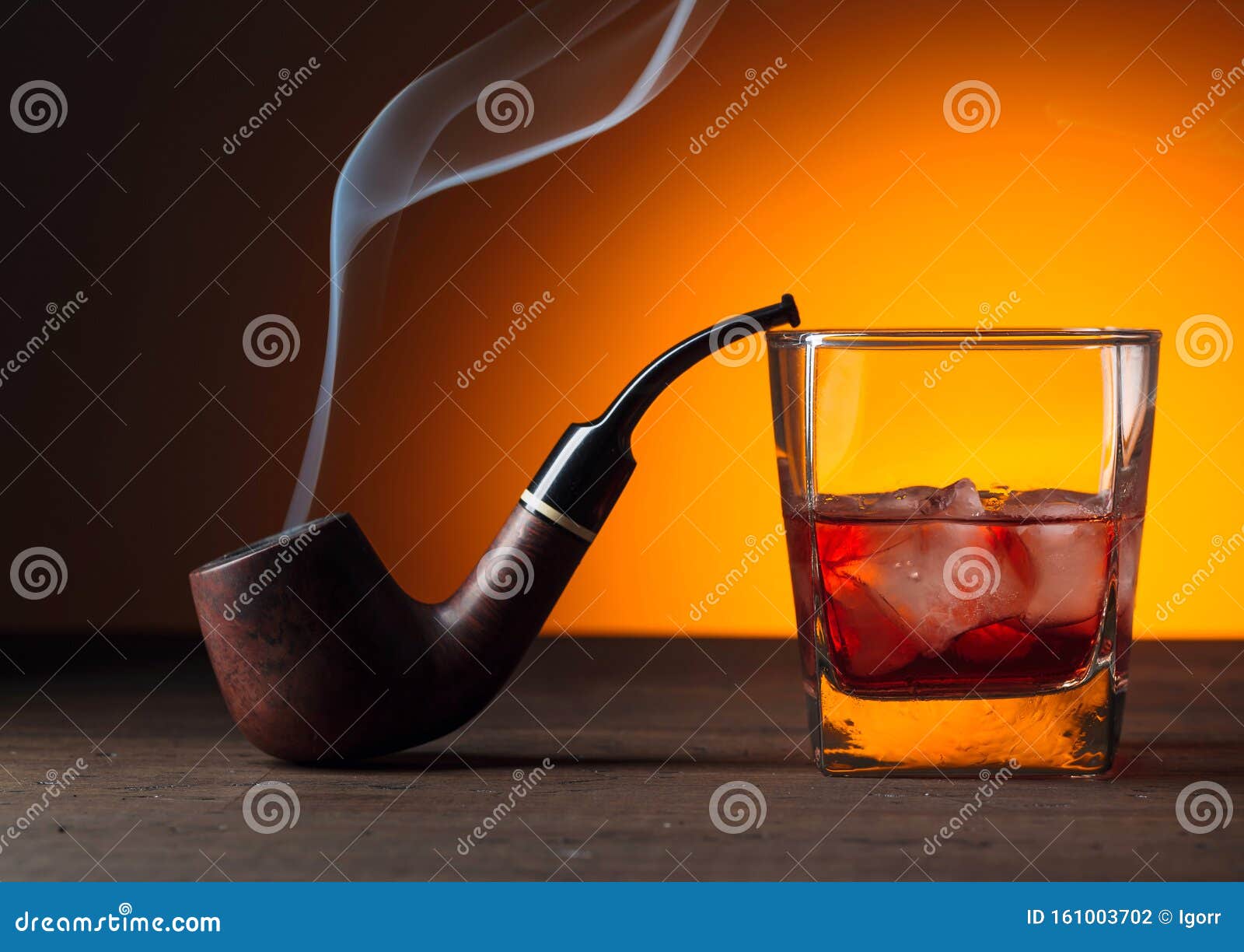 Whiskey with Natural Ice and Smoking Pipe Stock Photo - Image of gold ...