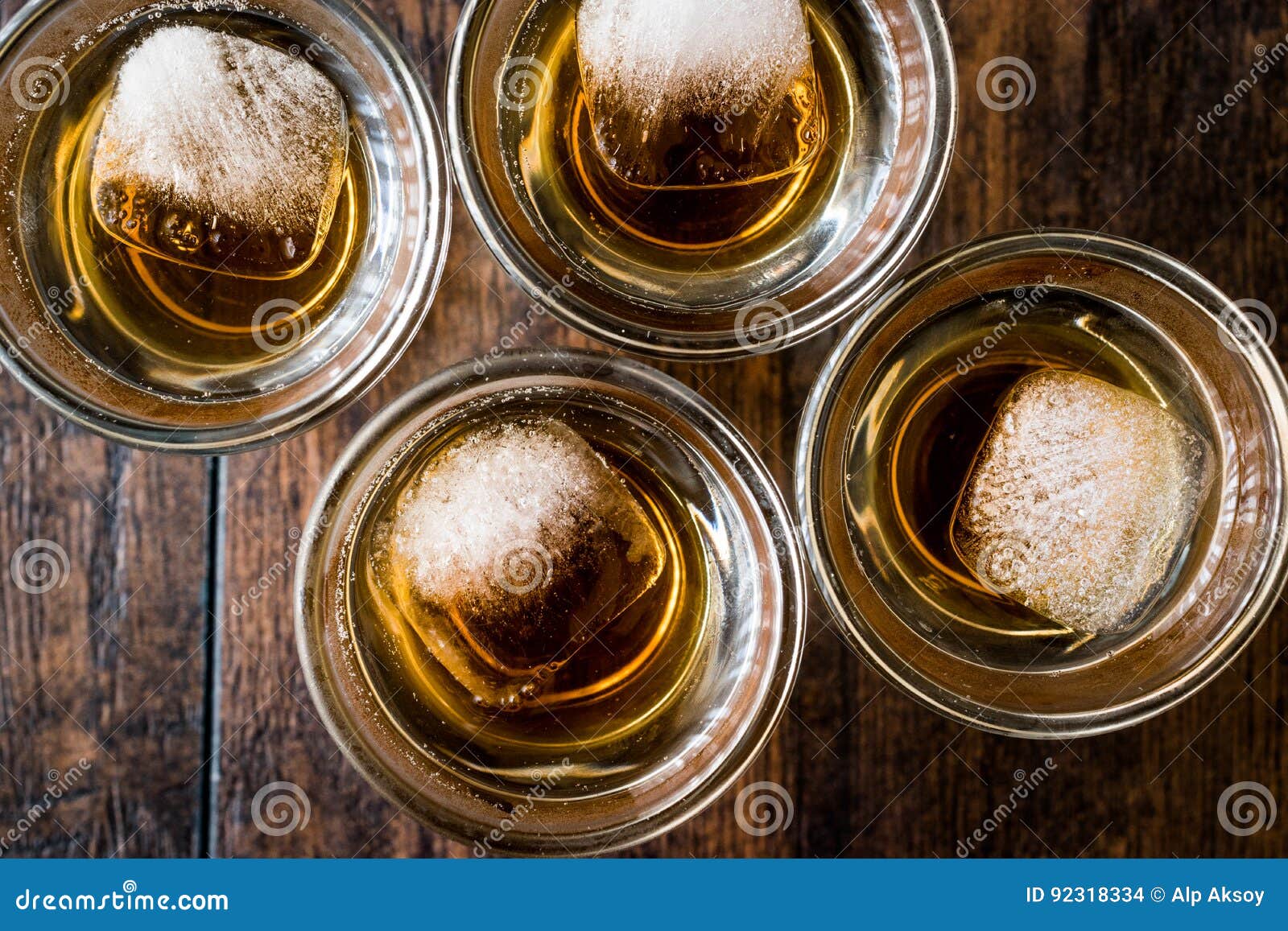 Whiskey Shots with Ice on Dark Wooden Surface. Stock Photo - Image of ...