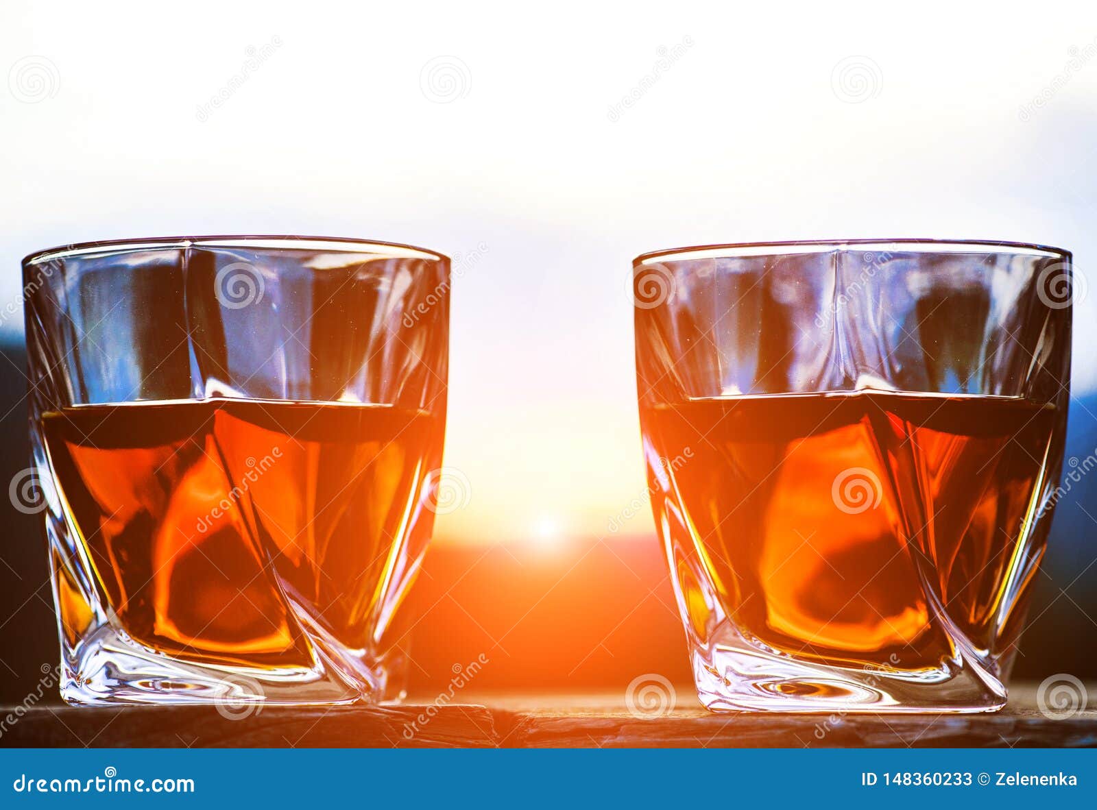 Whiskey at Sunset Dramatic Sky on Mountain Landscape Background Stock ...