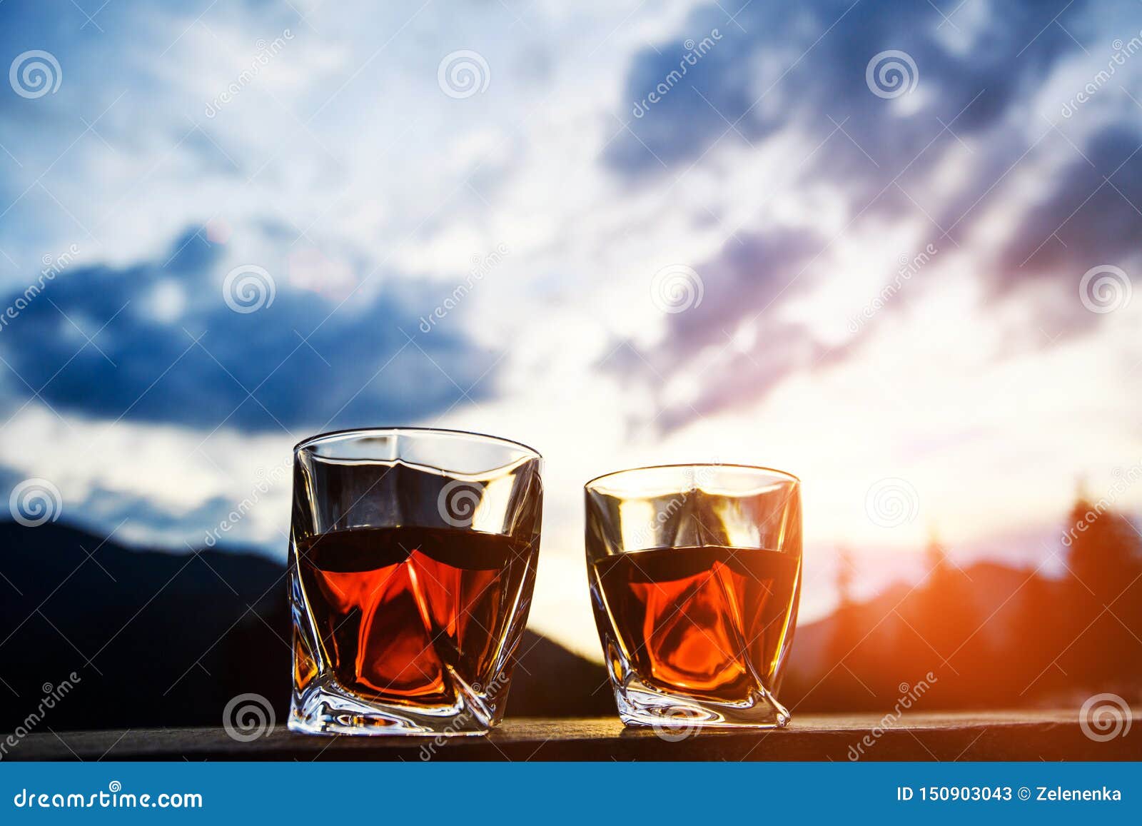 Whiskey at Sunset Dramatic Sky on Mountain Landscape Background Stock ...