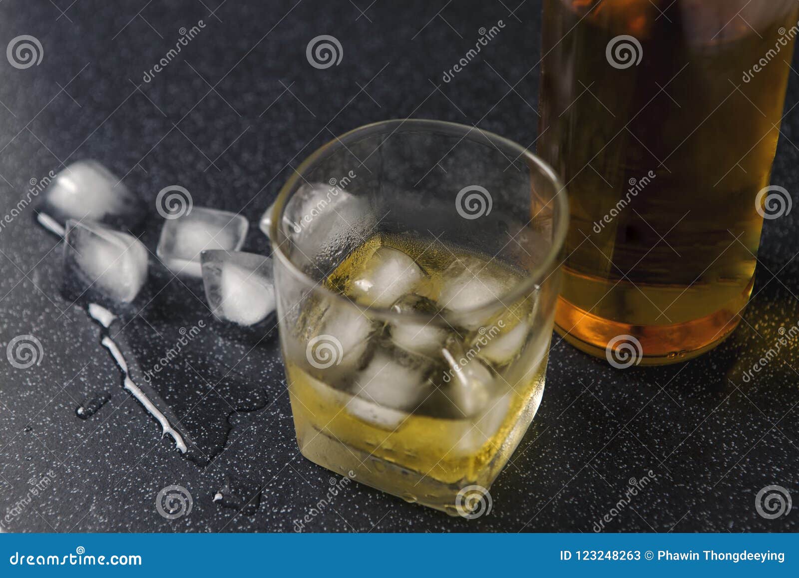 Whisky and Glass Drop Ice Cubes Stock Image - Image of orange, alcohol ...