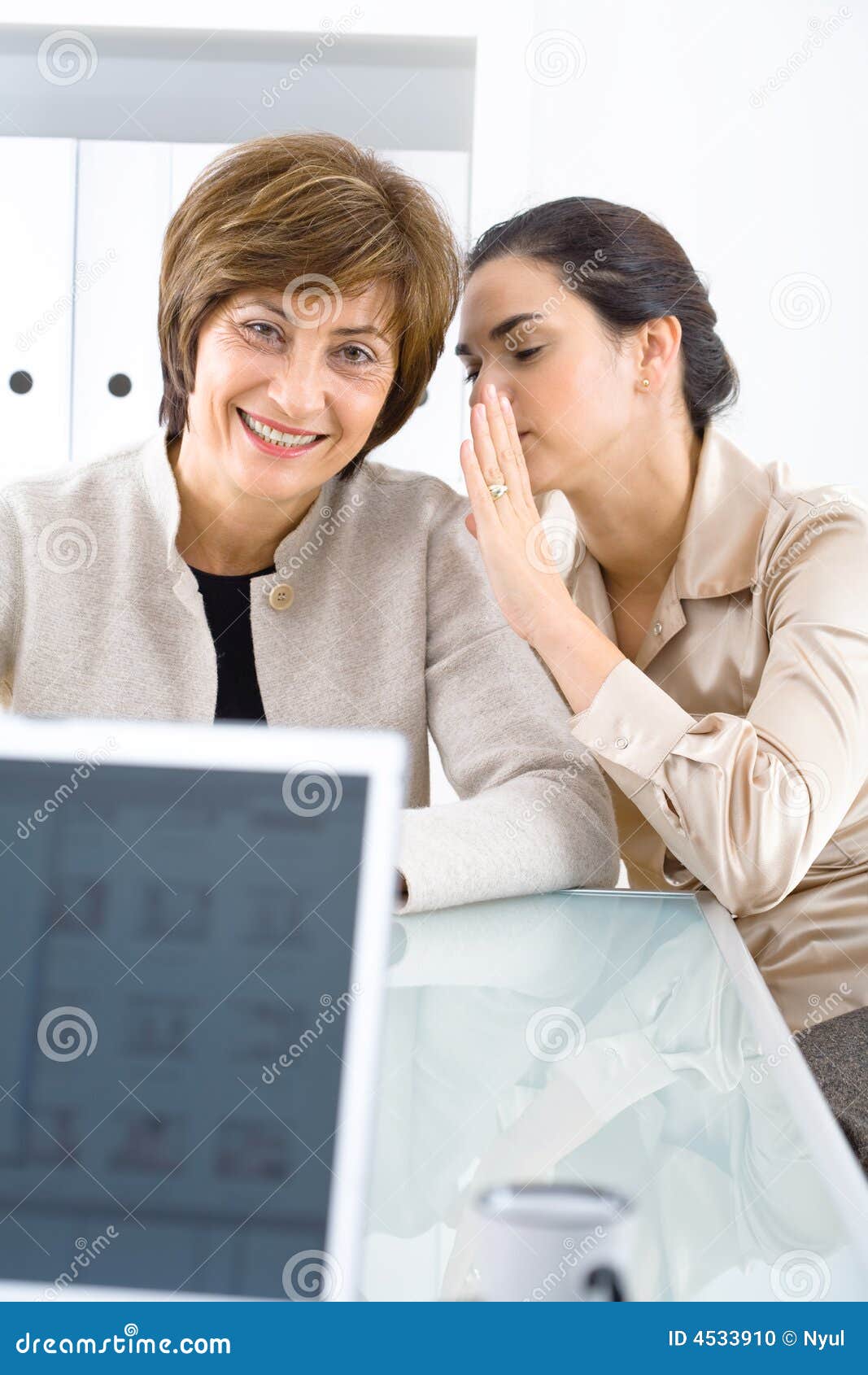 Whispering businesswomen stock photo. Image of chatting - 4533910