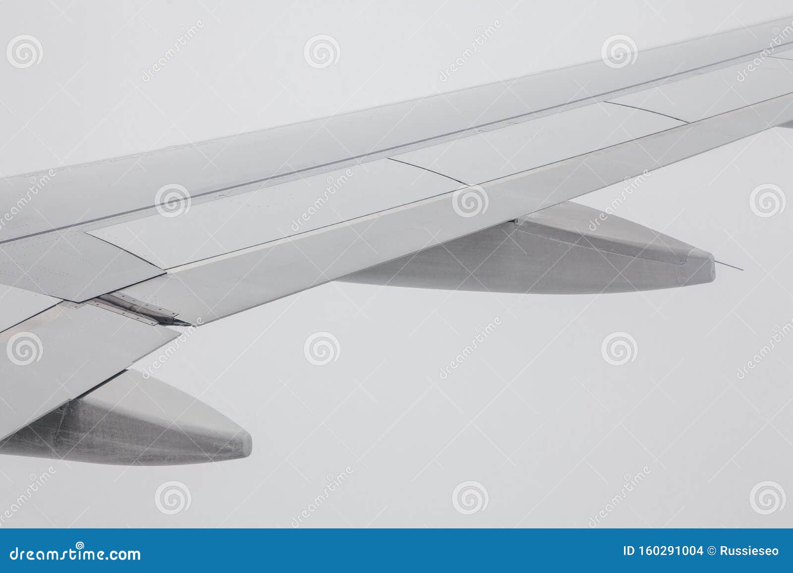 Airplane wing in flight stock photo. Image of business - 160291004