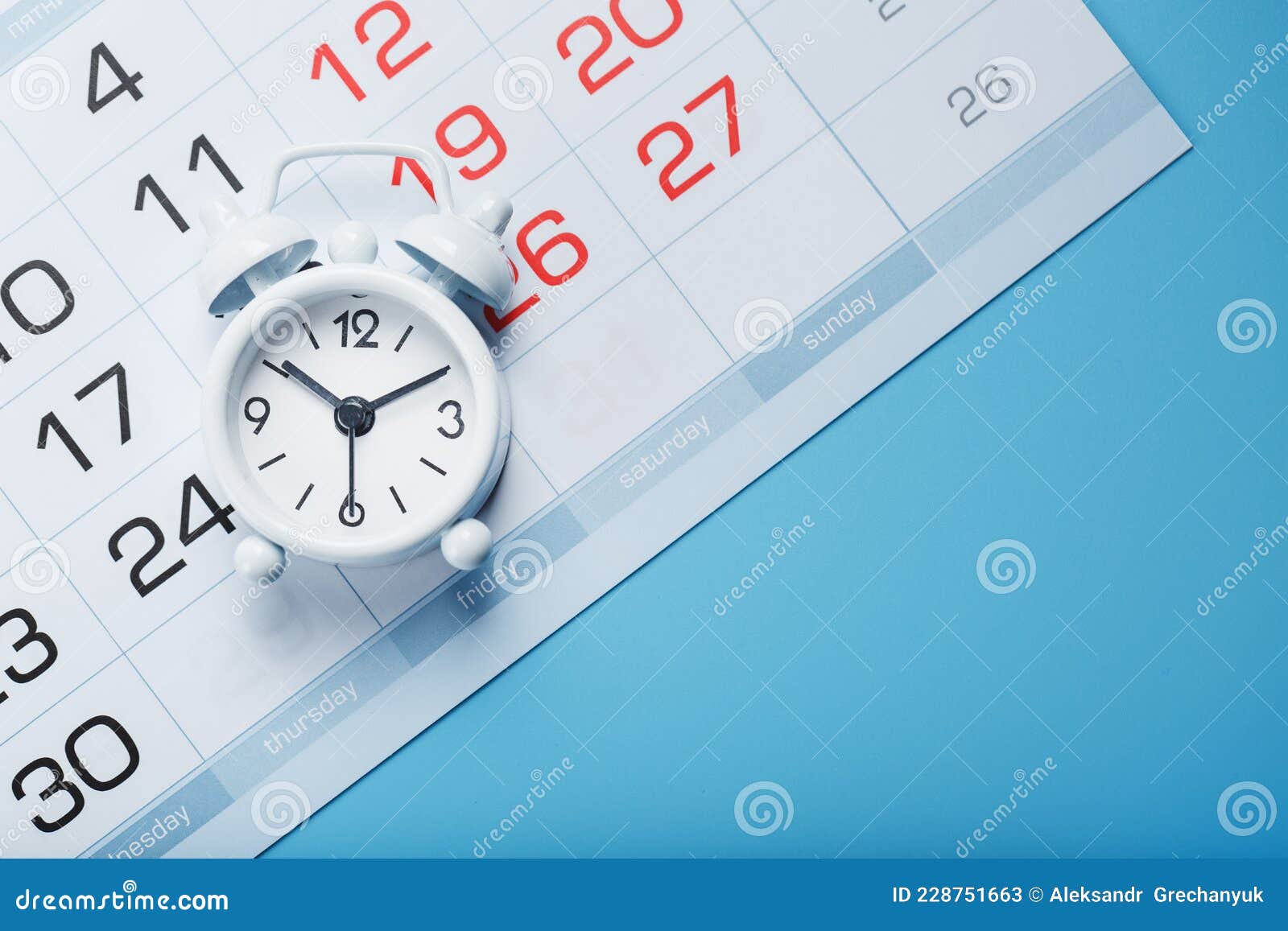The White Alarm Clock is on the Calendar with Dates Stock Image - Image ...