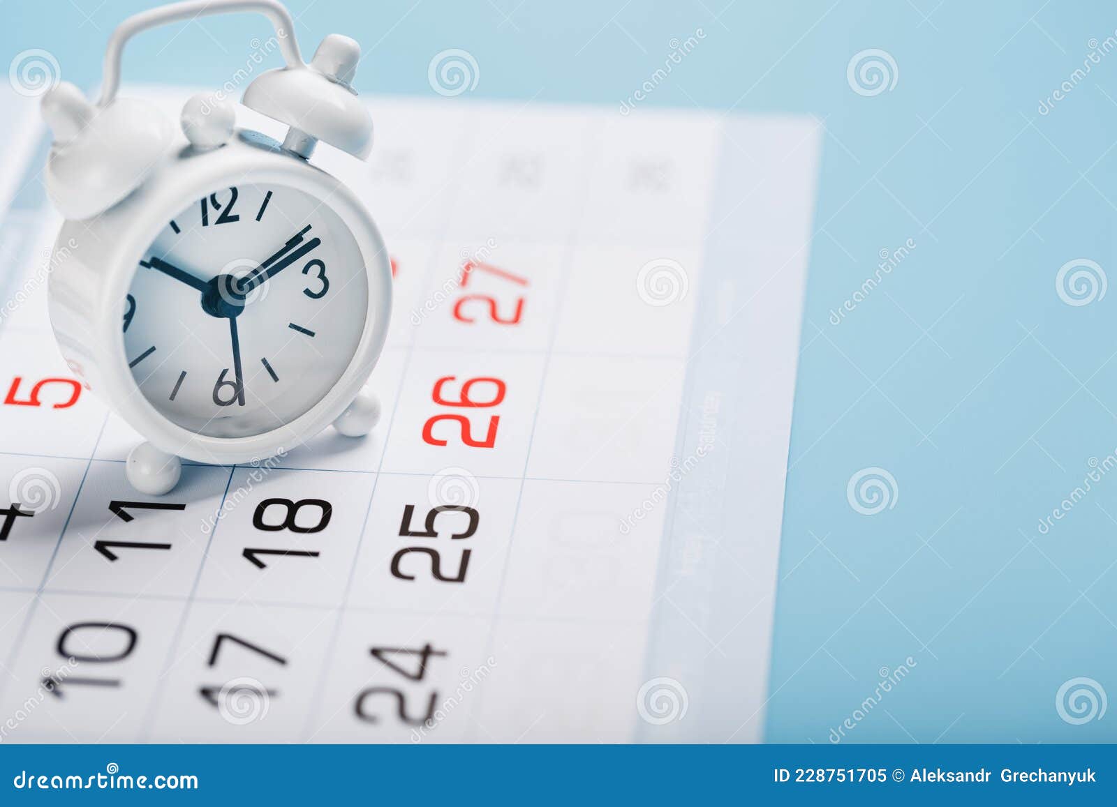 The White Alarm Clock is on the Calendar with Dates Stock Image - Image ...