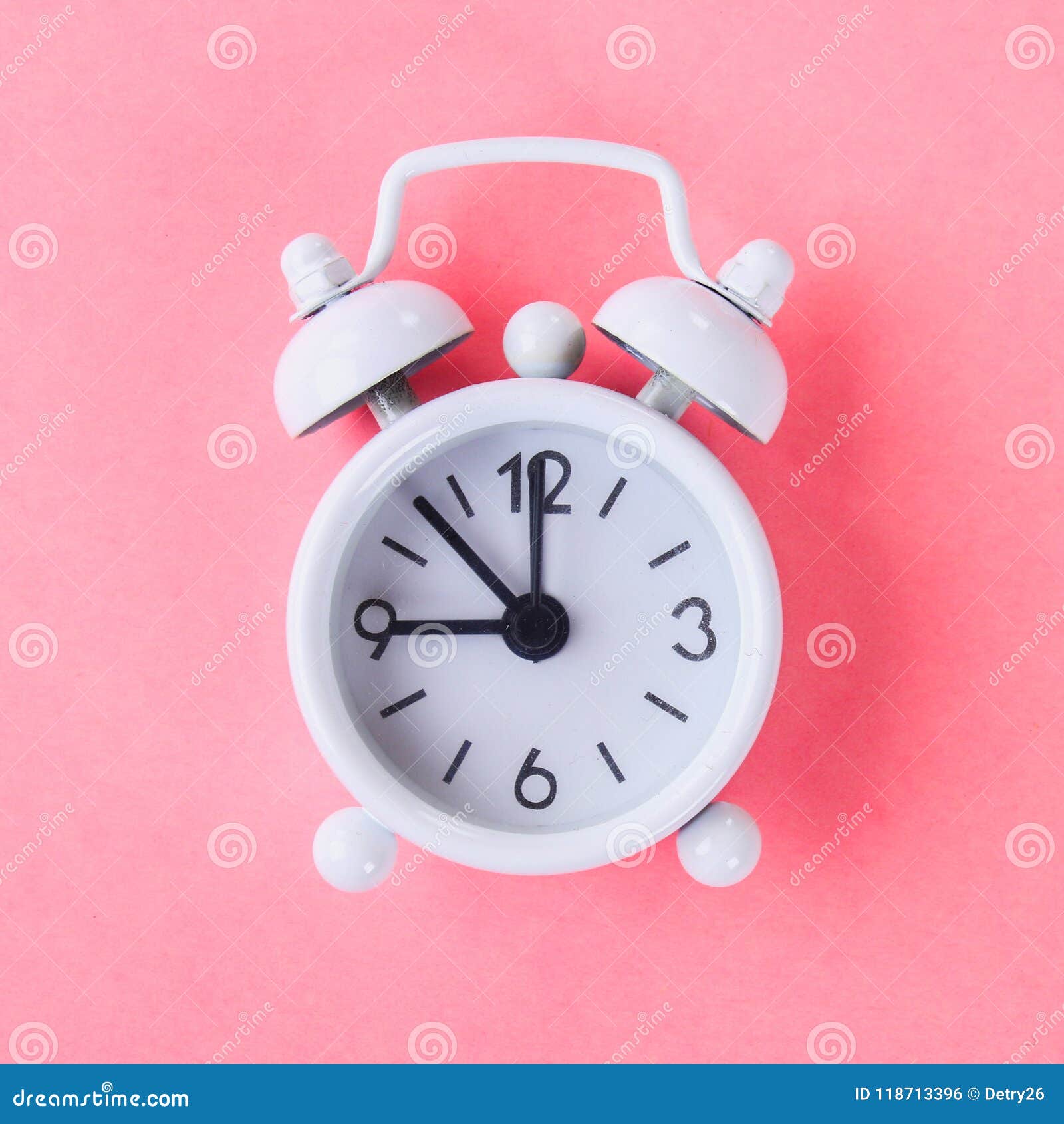 White Alarm Clock on a Pastel Blue, Pink Background. Stock Photo ...