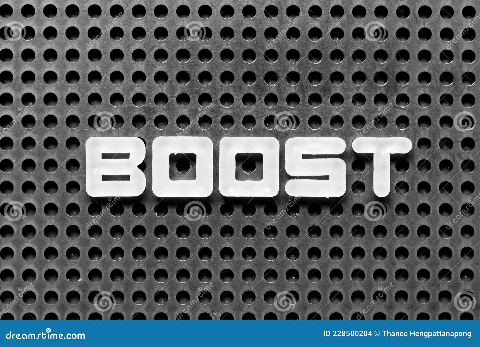 White Letter in Word Boost on Black Pegboard Background Stock Photo ...