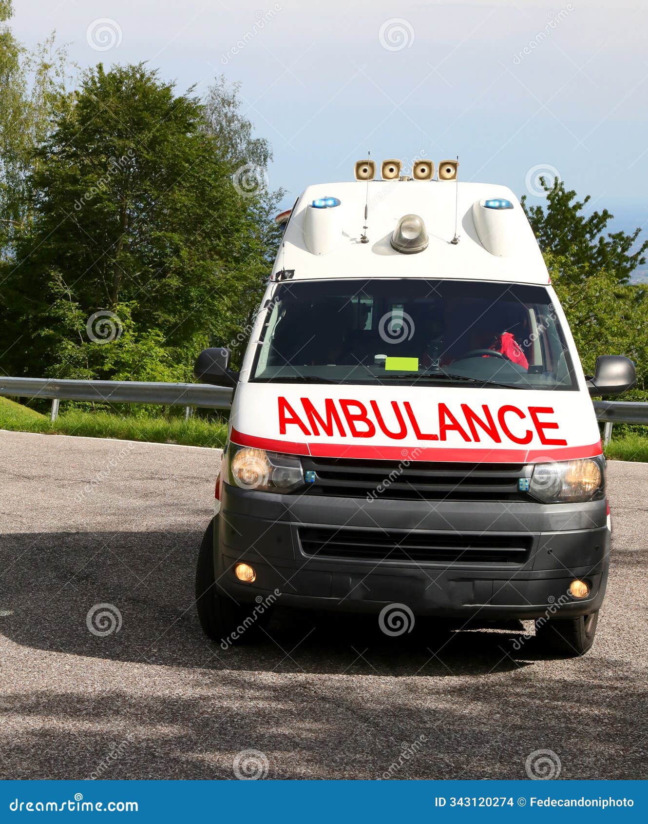 White Ambulance Van with Text Speeding Fast with Blue Lights Flashing ...