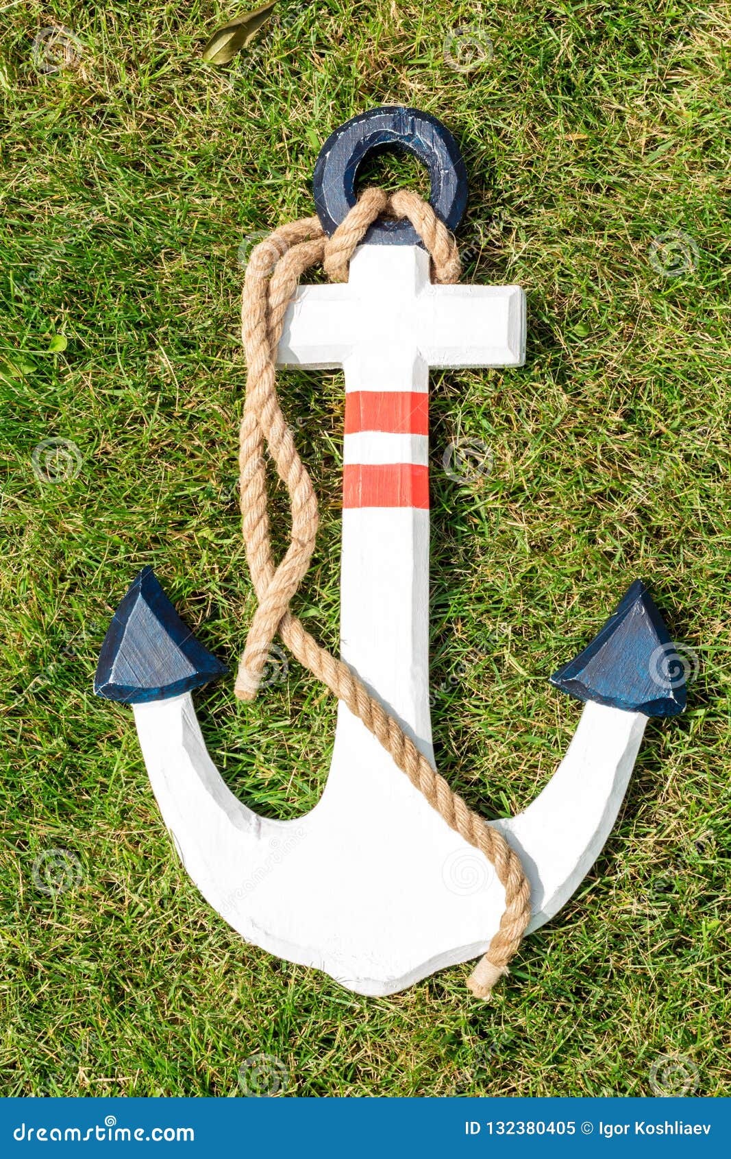 White anchor on green lawn stock image. Image of white - 132380405