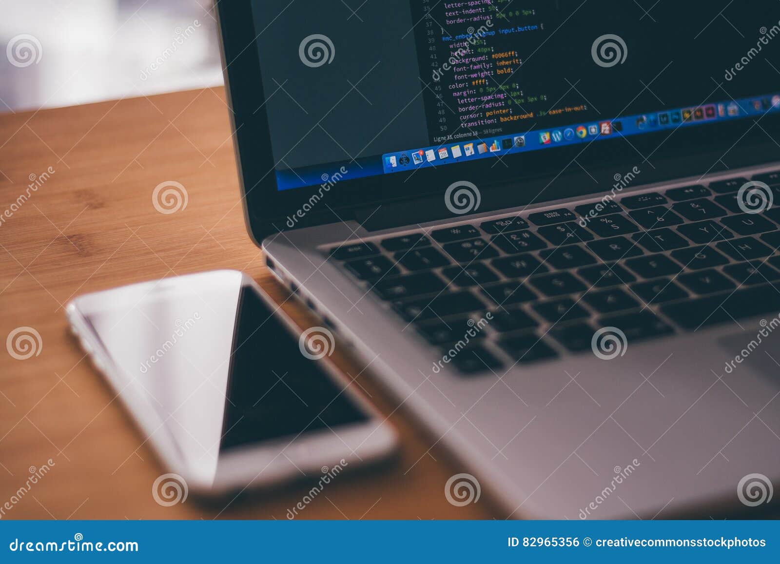 White Android Smartphone Near Grey Laptop Computer Picture. Image: 82965356