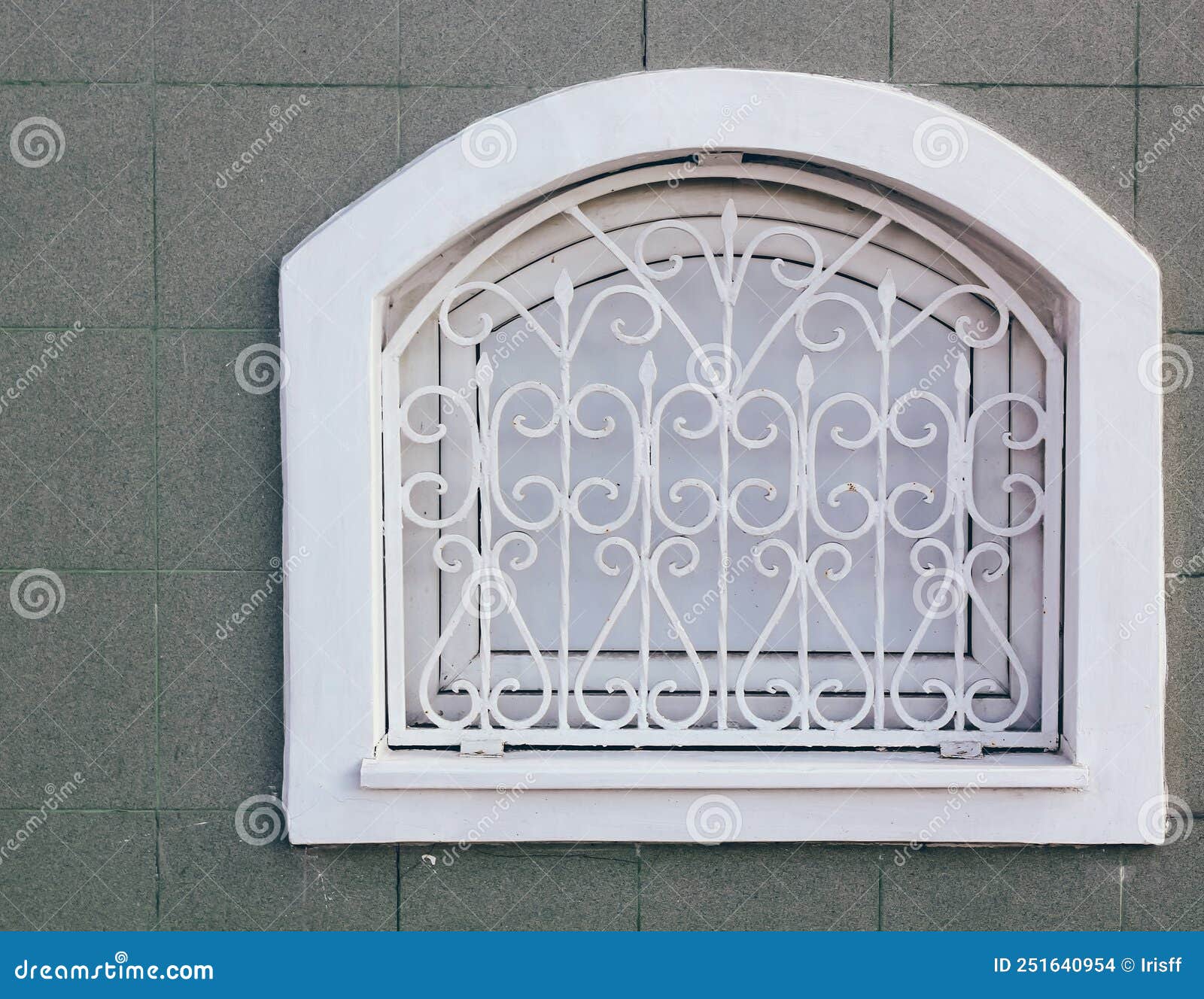White Arched Window with Openwork Lattice on Gray Tiled Wall Stock ...