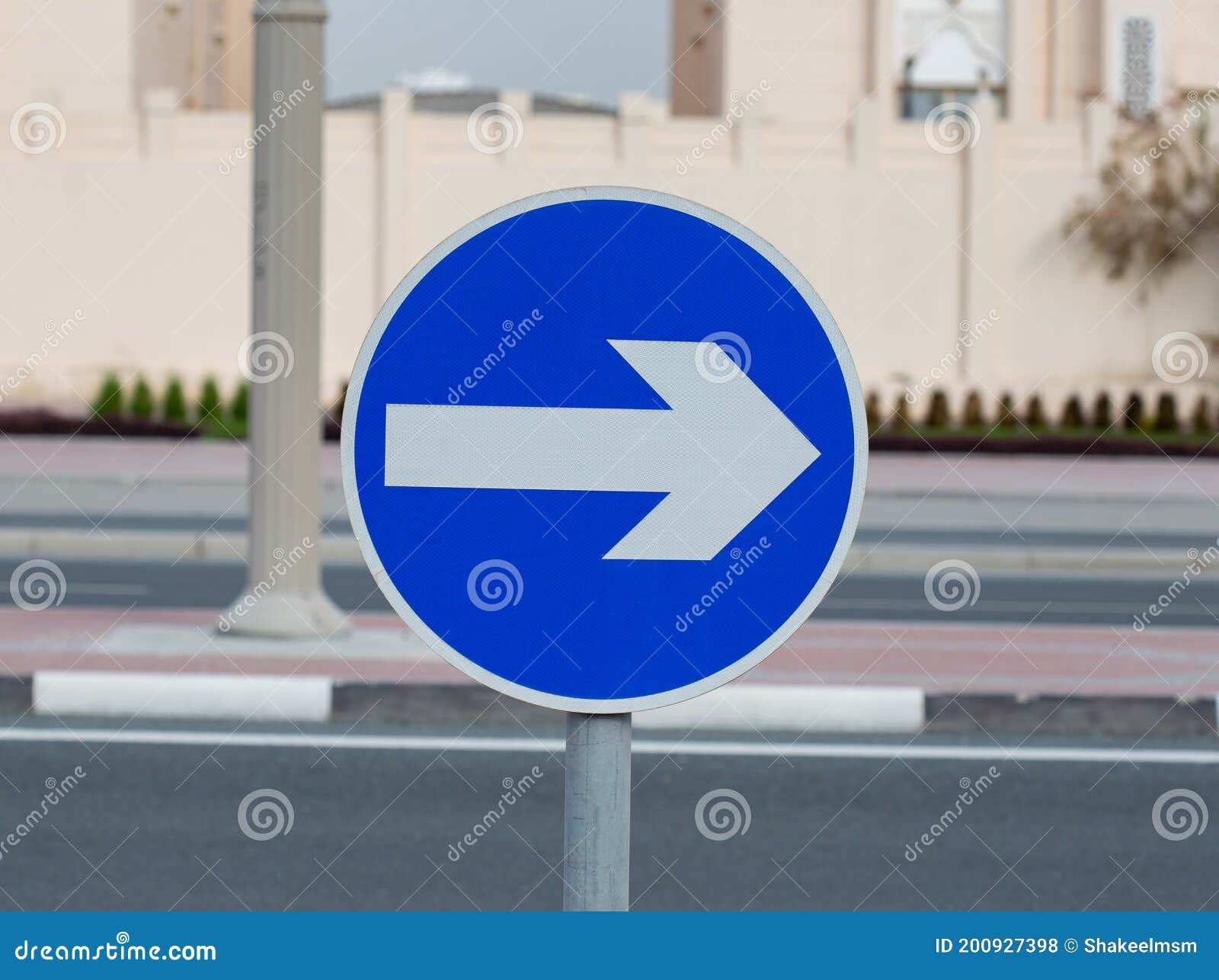 White Arrow on Blue Traffic Sign on the Road To Guide Traffic Stock ...