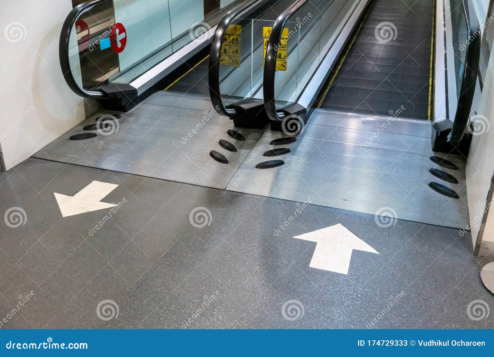 White Arrow Forward on Escalator Floor. Abstract Floor Pattern with ...