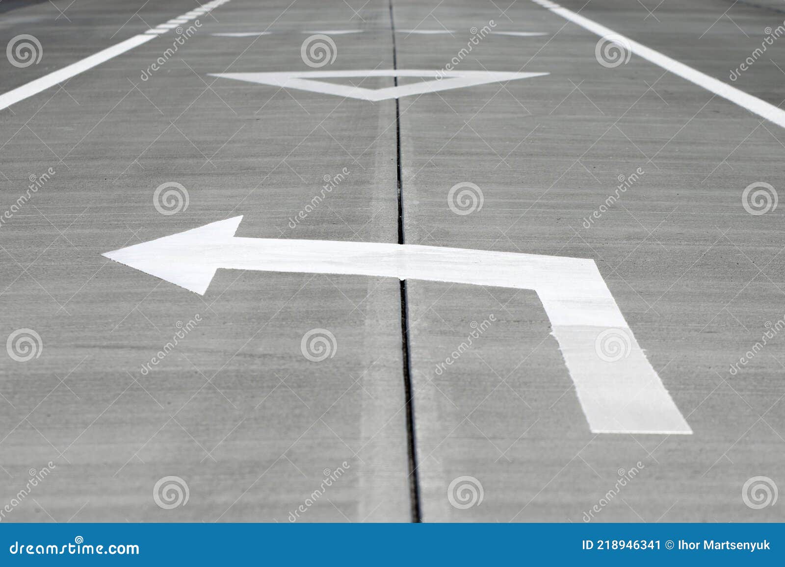 White Arrow on the Highway. Left Turn. Traffic Regulation Stock Image ...