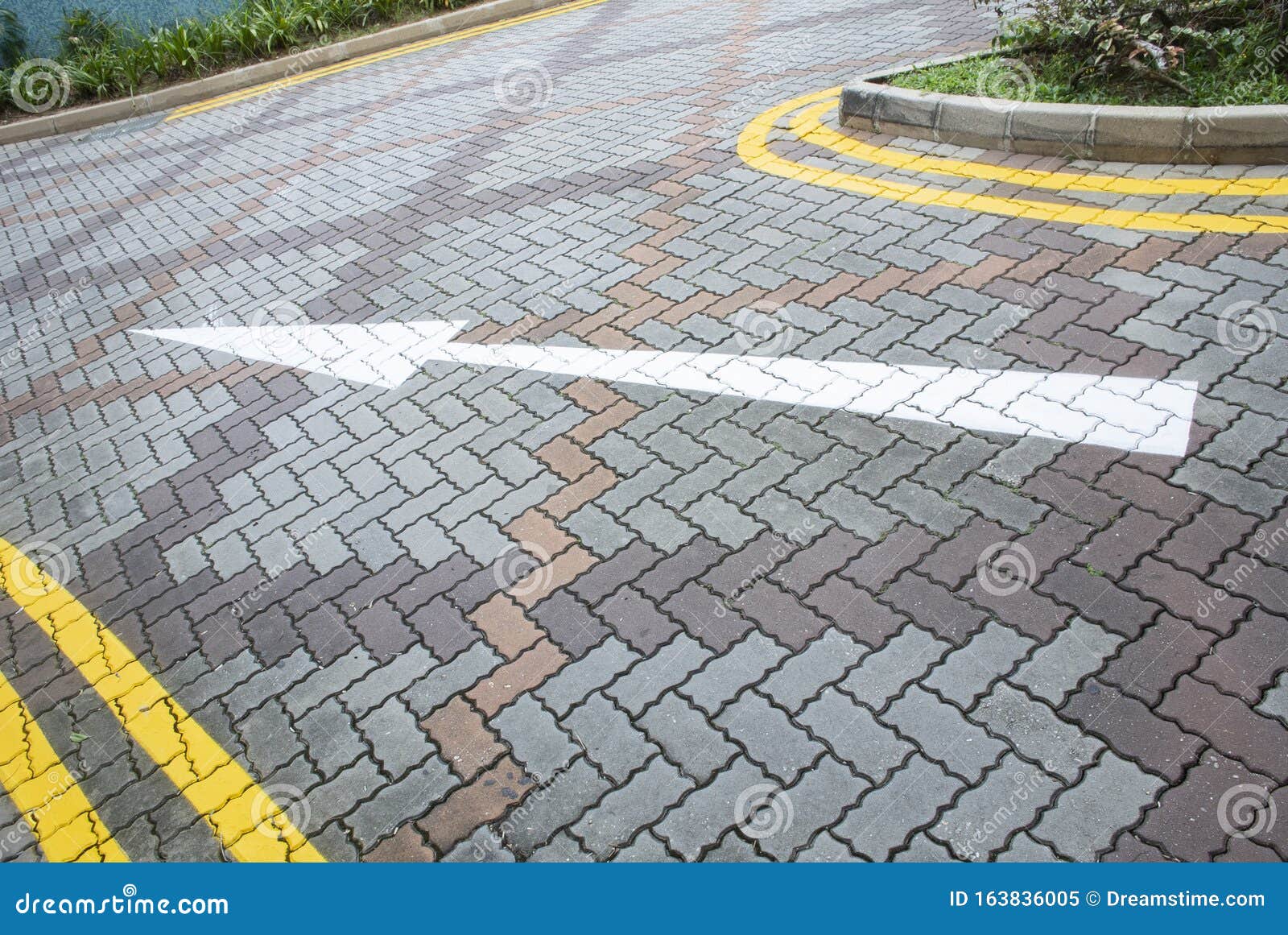 White Arrow Painted on Interlocking Concrete Pavement Stock Image ...