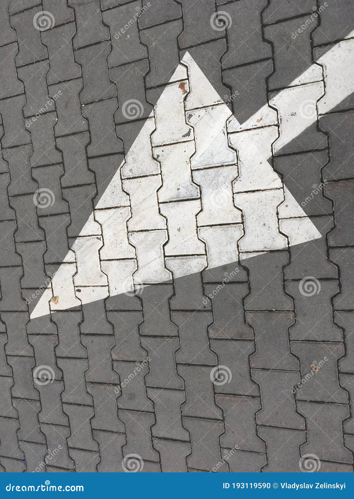 White arrow on road tile stock photo. Image of brick - 193119590