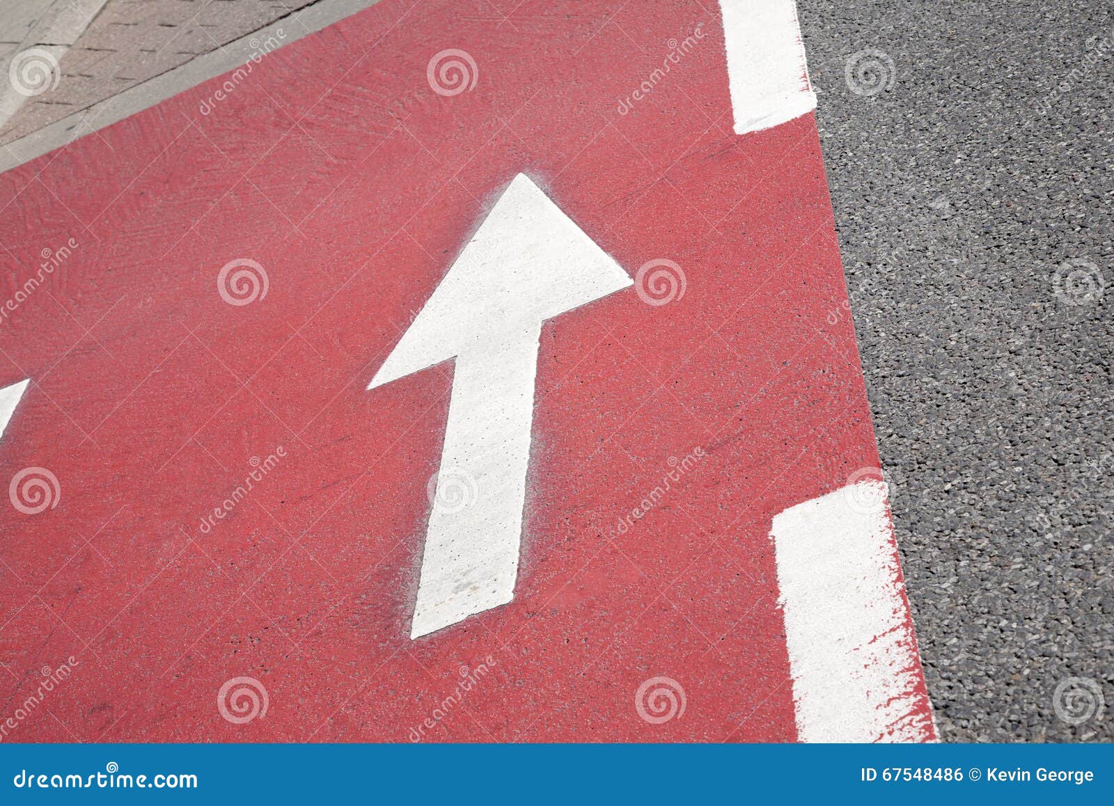 White Arrow Sign on Red Cycle Path Stock Photo - Image of street ...
