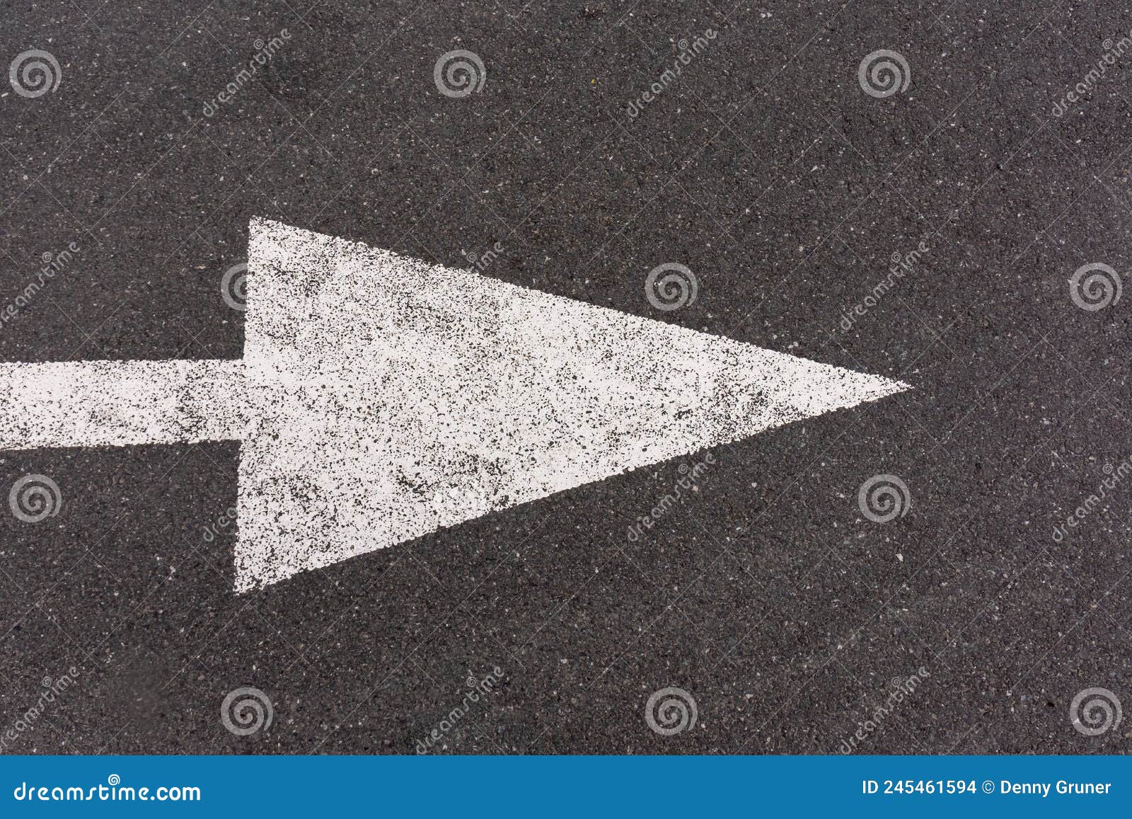 A white arrow on a street stock photo. Image of concept - 245461594