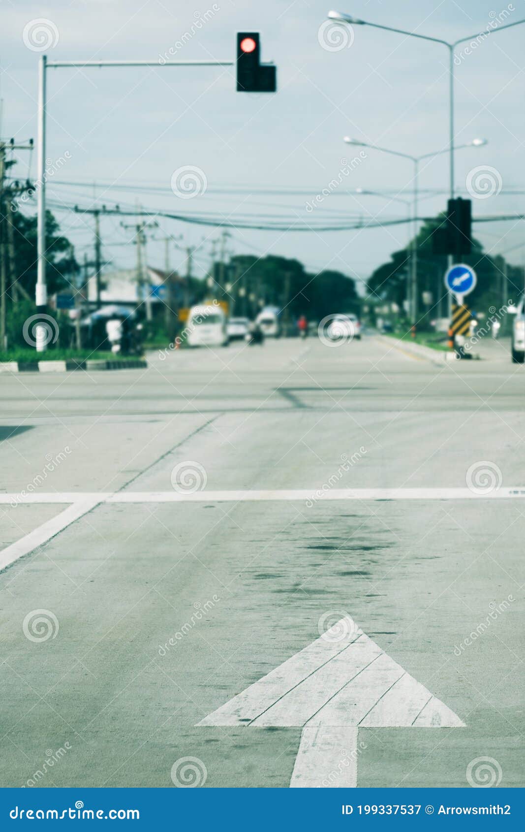 White Arrow Symbol on on Crossroad with Red Traffic Light Stock Image ...
