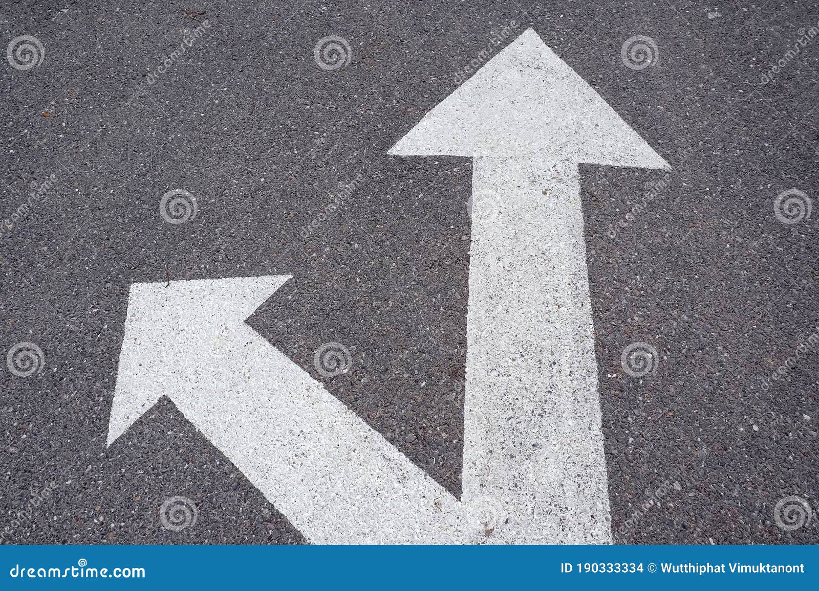 The White Arrow Symbol Points Forward and To the Left on the Road Stock ...