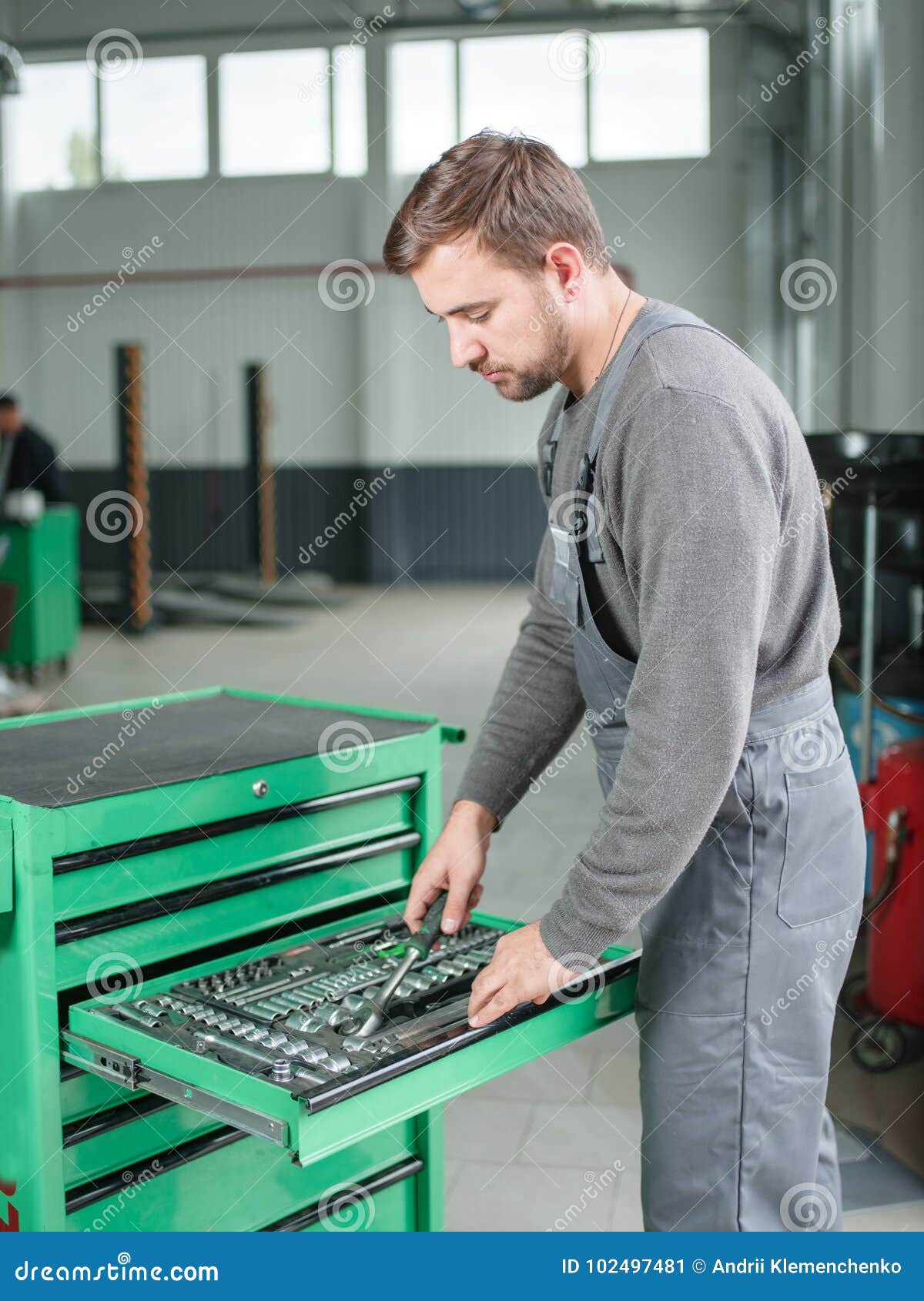 Auto Mechanic Takes Tool Tool Tool Box Indoors Stock Photos by Megapixl