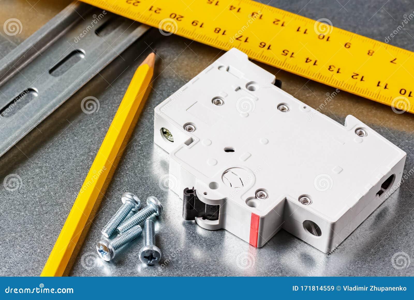 White Automatic Circuit Breaker Lying On Shiny Metal Mounting Plate Of ...