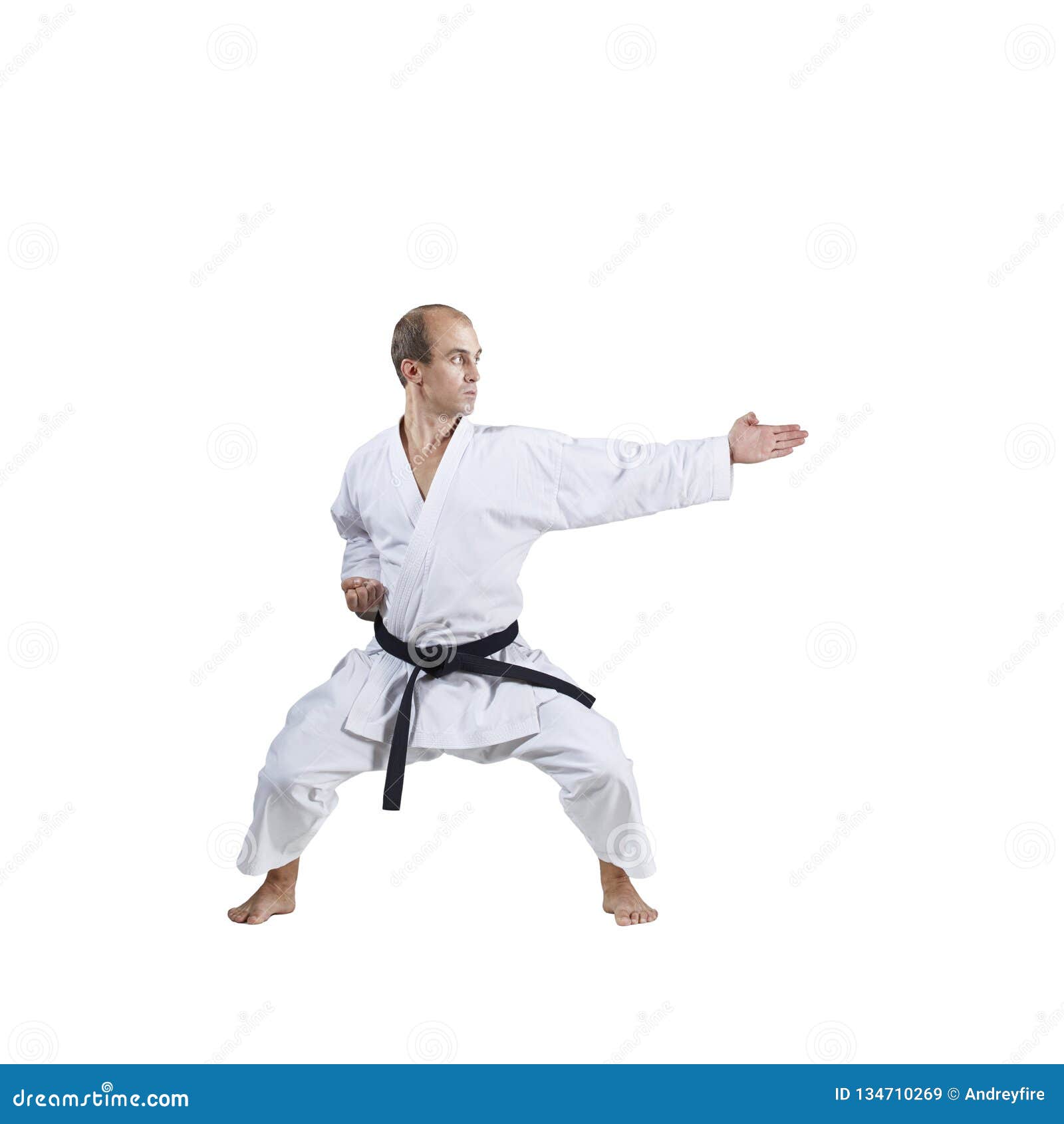 On a White Background, an Active Adult Athlete Performs Formal Karate ...