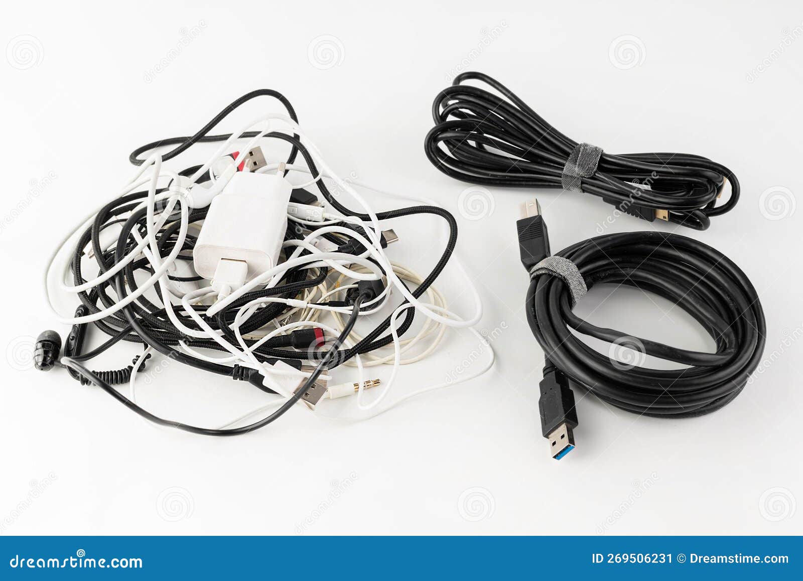 On A White Background, A Bunch Of Tangled Wires And A Number Of Folded ...