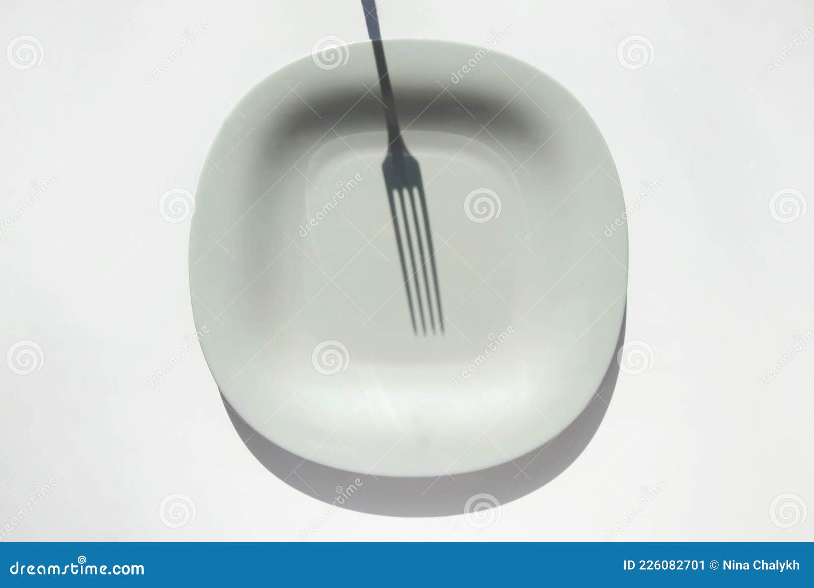 On White Background, Gray Empty Plate with Shadow from Fork. Shadow of ...