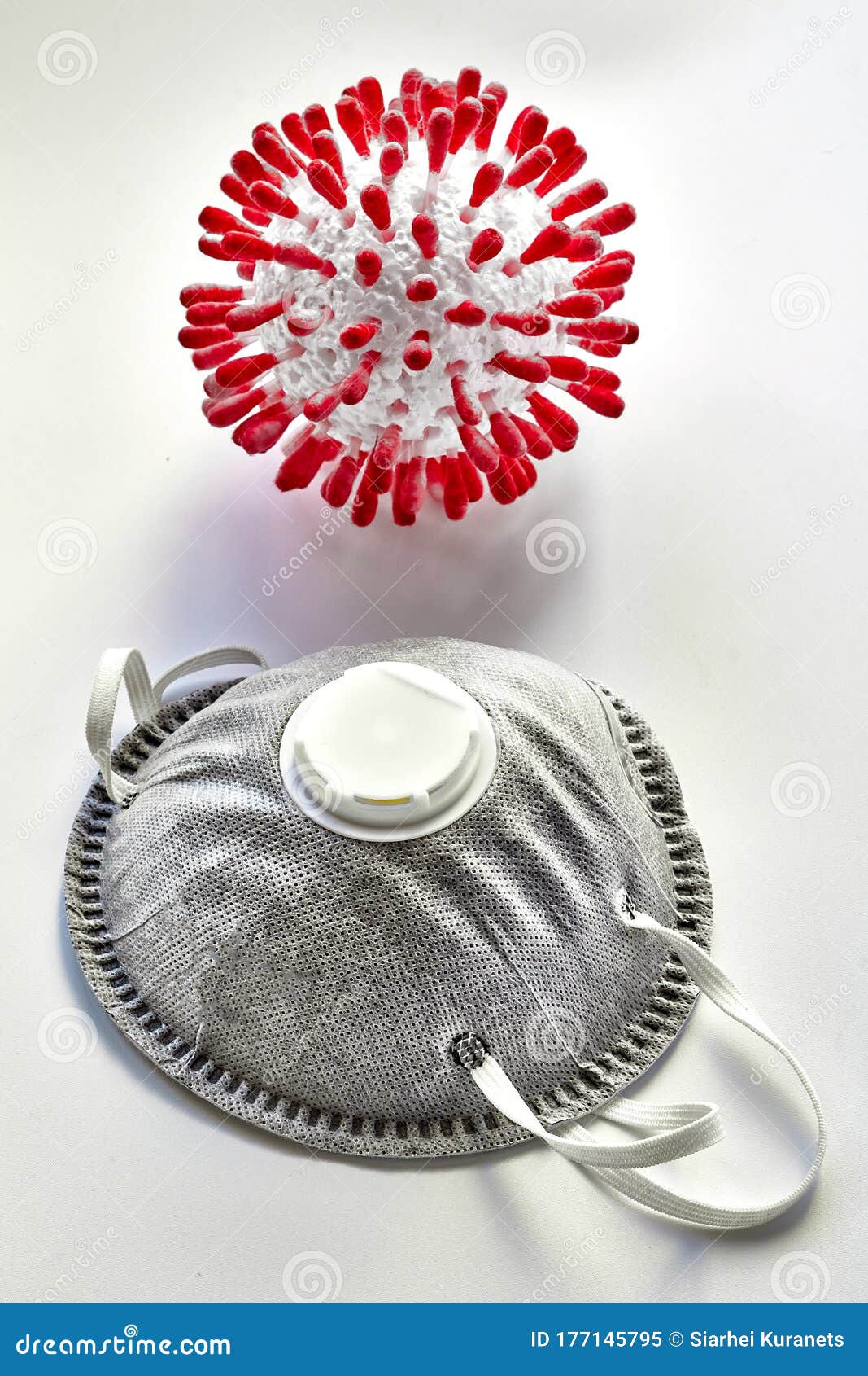 On a White Background a Medical Mask and a Model of a Virus Molecule ...