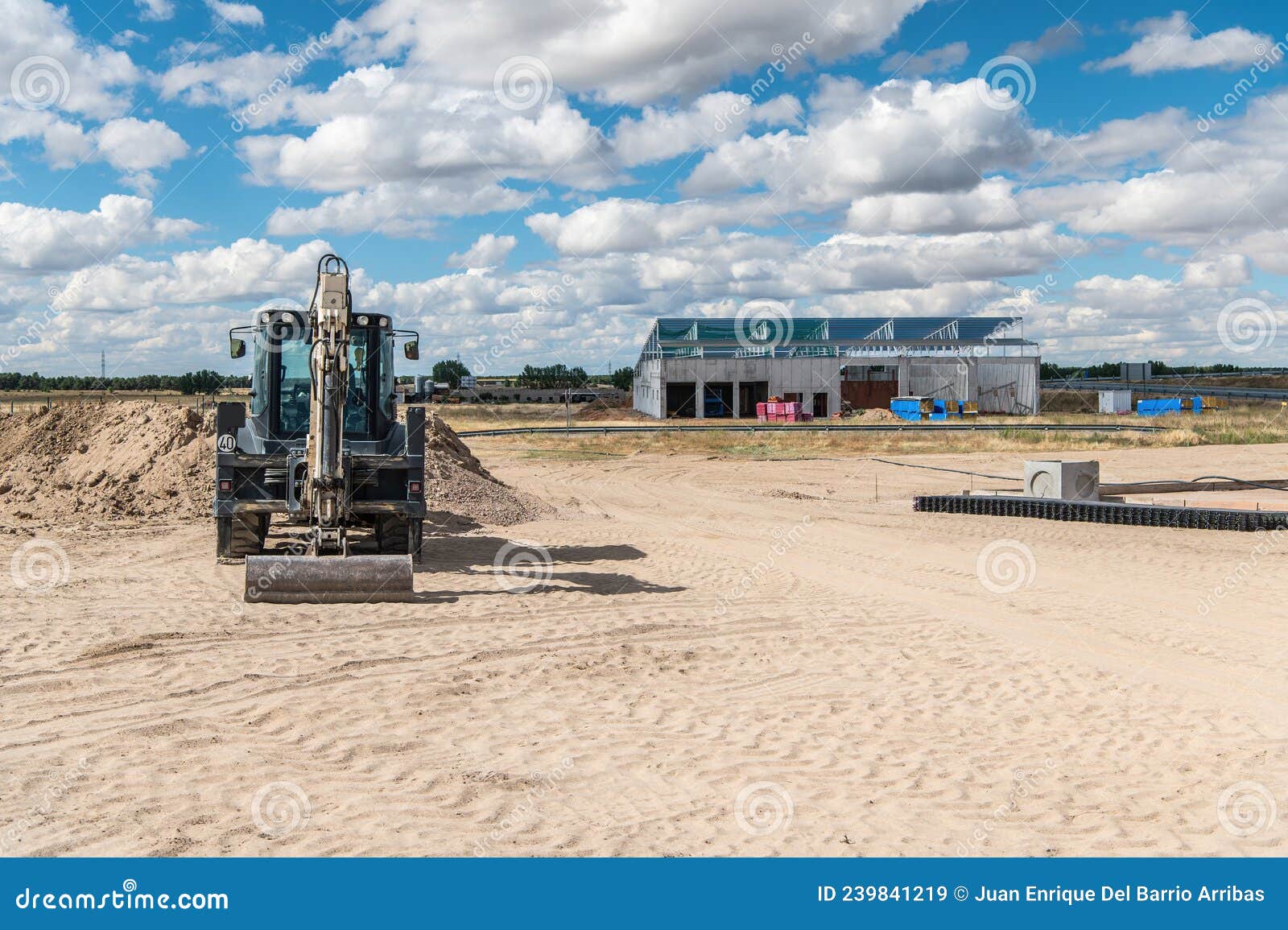 A White Backhoe at a Construction Site Stock Image - Image of sand ...