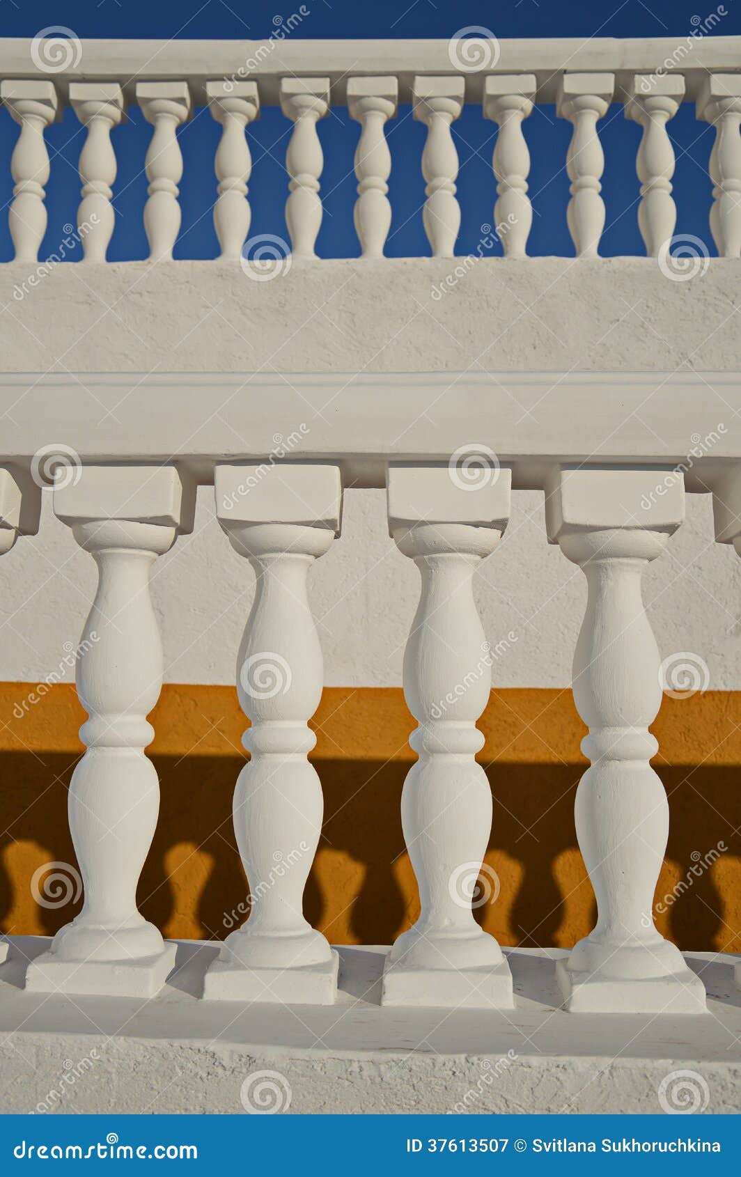 White Balusters on the Yellow and Blue Backgrounds Stock Image - Image ...
