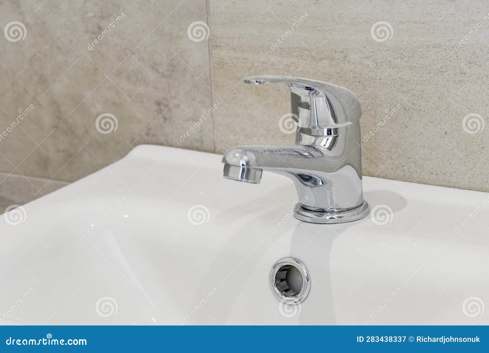 White Basin with Chrome Mixer Tap on Vanity Unit Stock Image - Image of ...