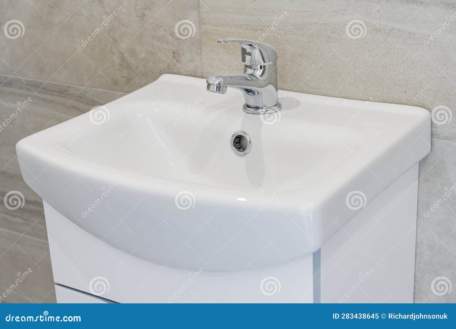 White Basin with Chrome Mixer Tap on Vanity Unit Stock Image - Image of ...
