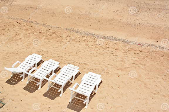 4 white beach chairs stock image. Image of person, chairs - 94454755