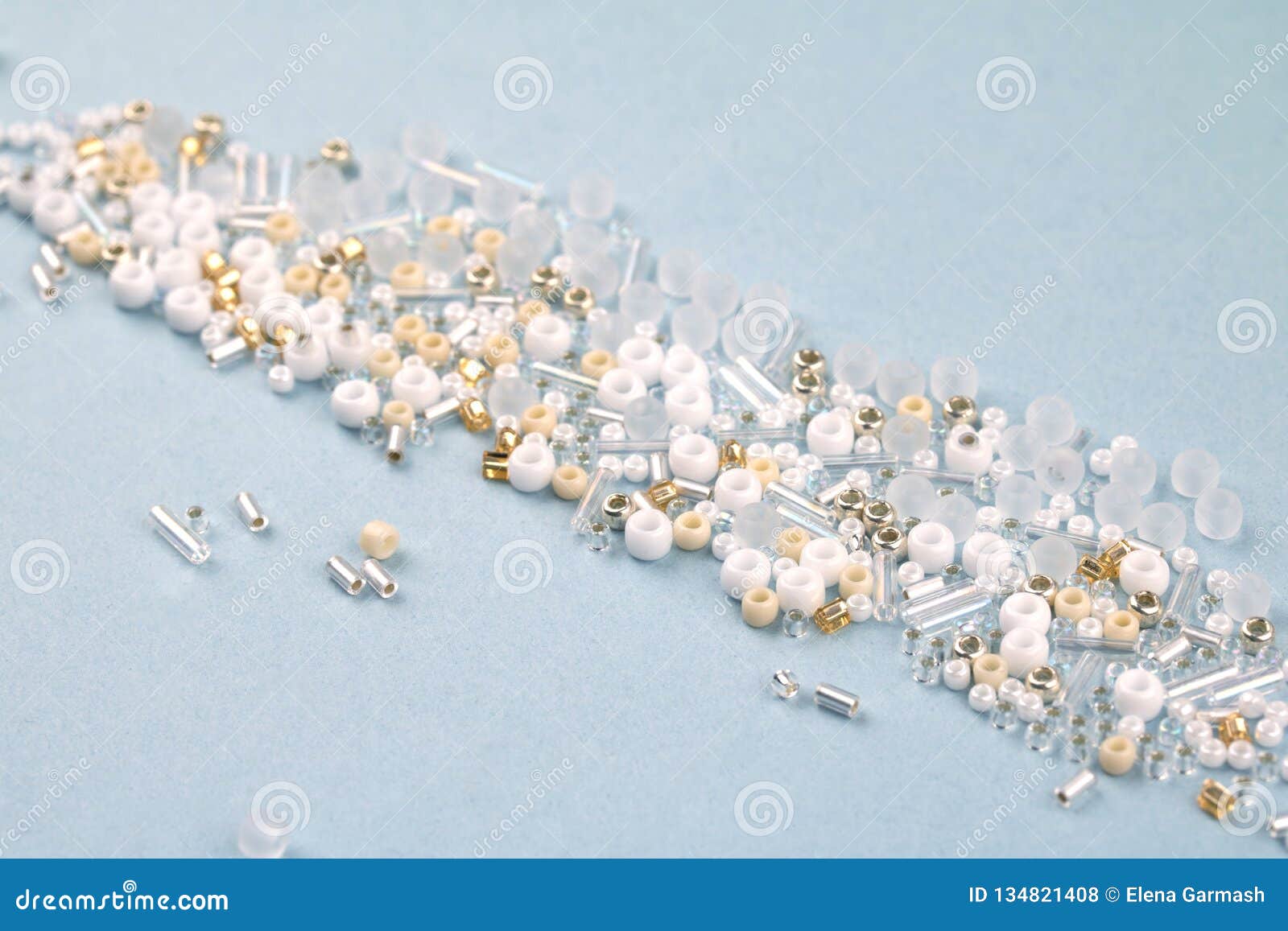White Beads in a Pile, Blue Surface. Stock Photo - Image of craft, bead ...