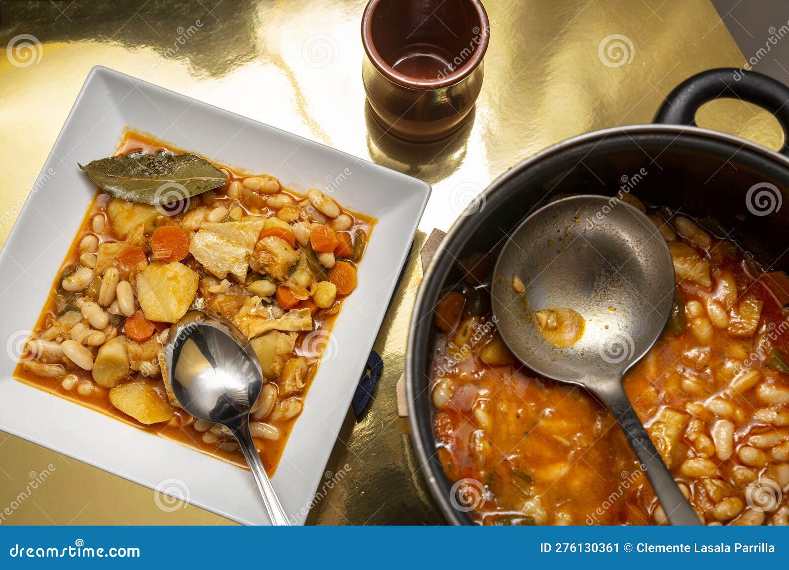 White Bean and Cod Stew in a Casserole and Served on a Plate with a ...