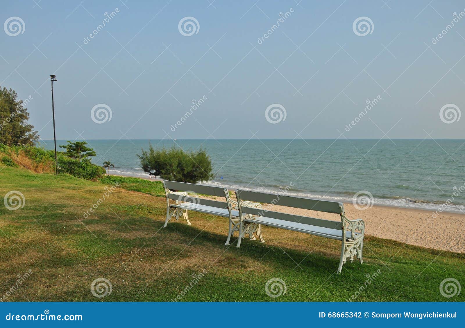 White Benches on the Beach in Front of the Sea Stock Photo - Image of ...