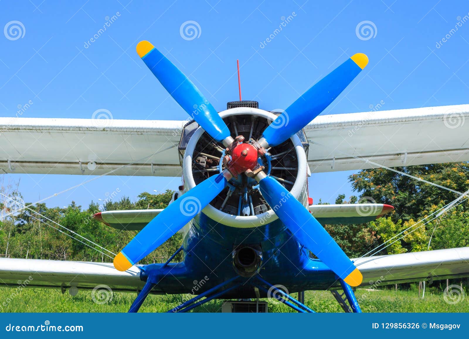 White Biplane with Blue Engine Stock Photo - Image of military ...