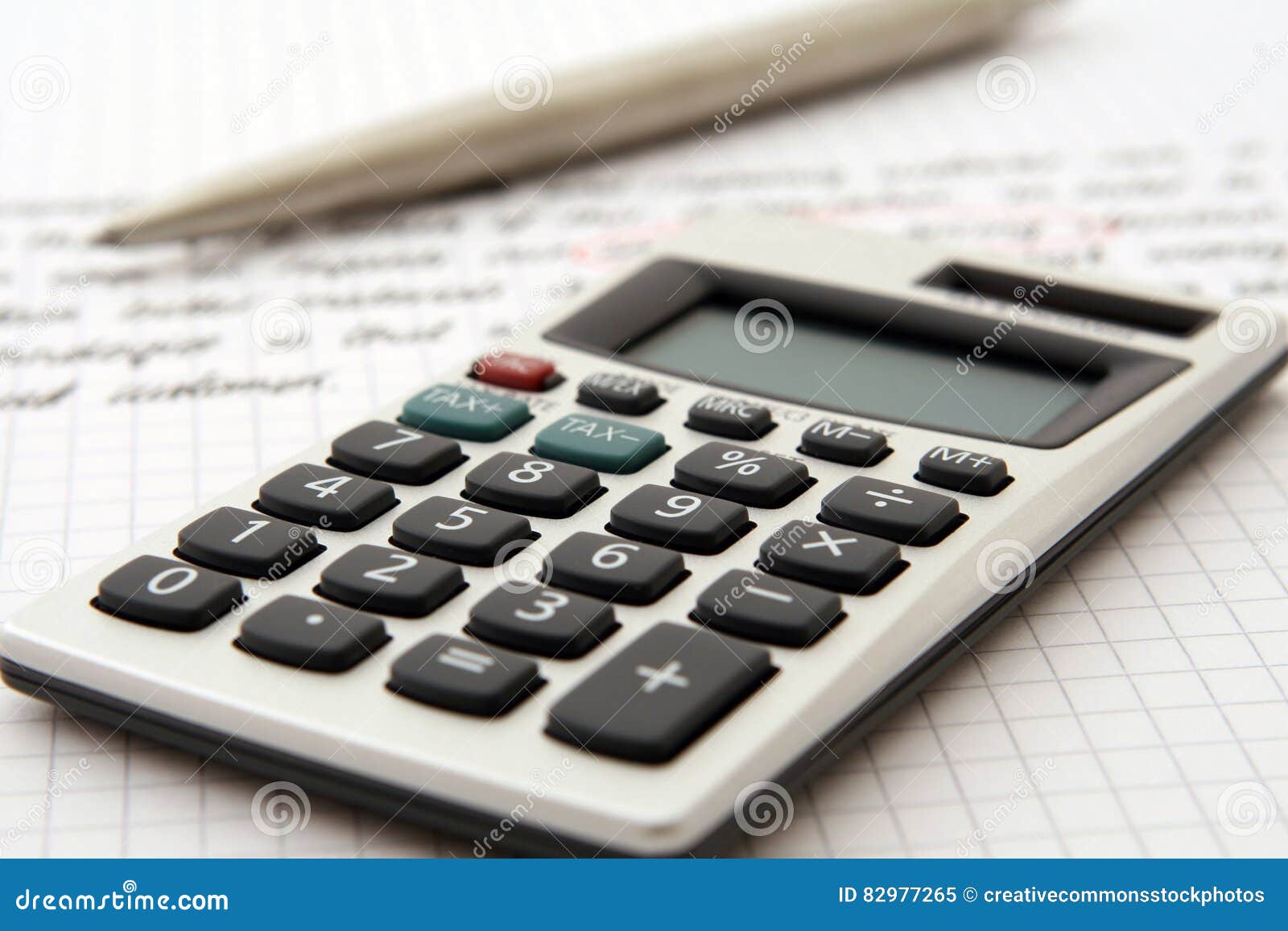 White And Black Desk Calculator On White Graphing Paper Picture. Image ...