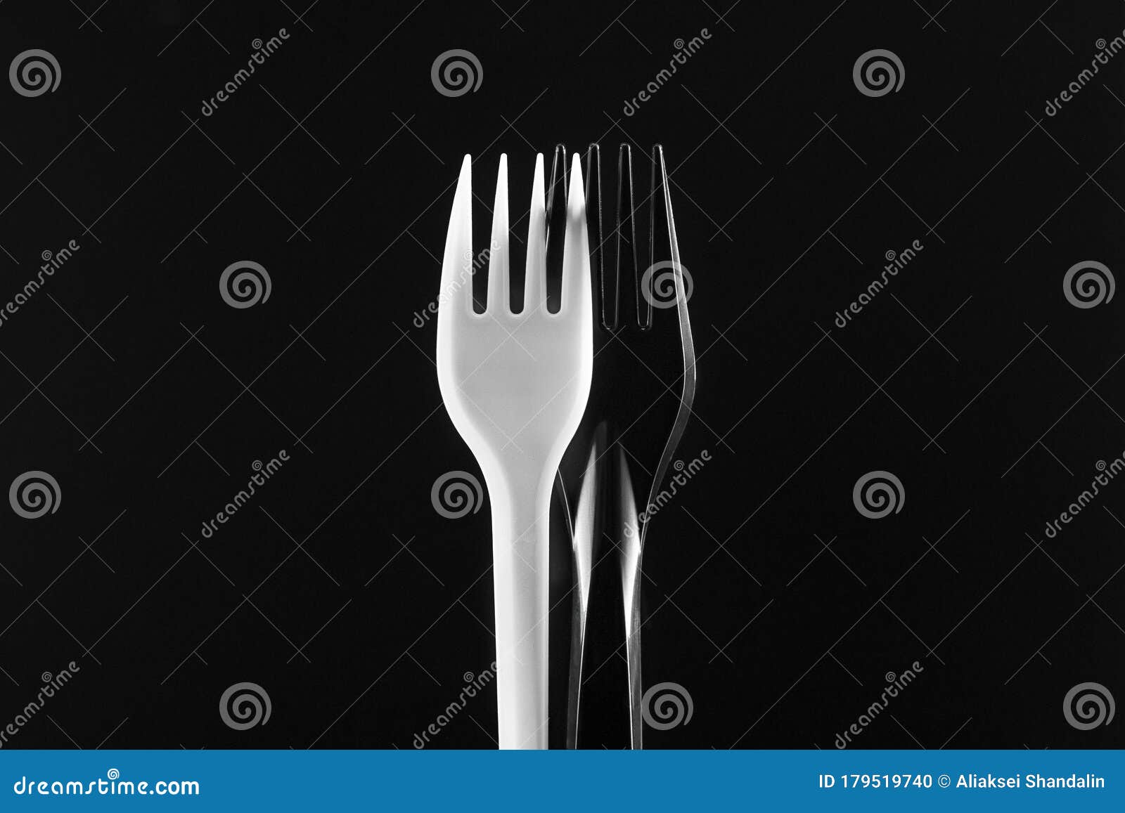 White and Black Plastic Forks on a Black Background. Stock Photo ...