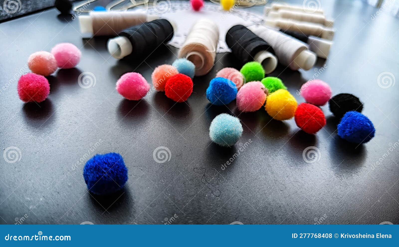 White and Black Spools of Thread with Decorative Napkin and Colored ...