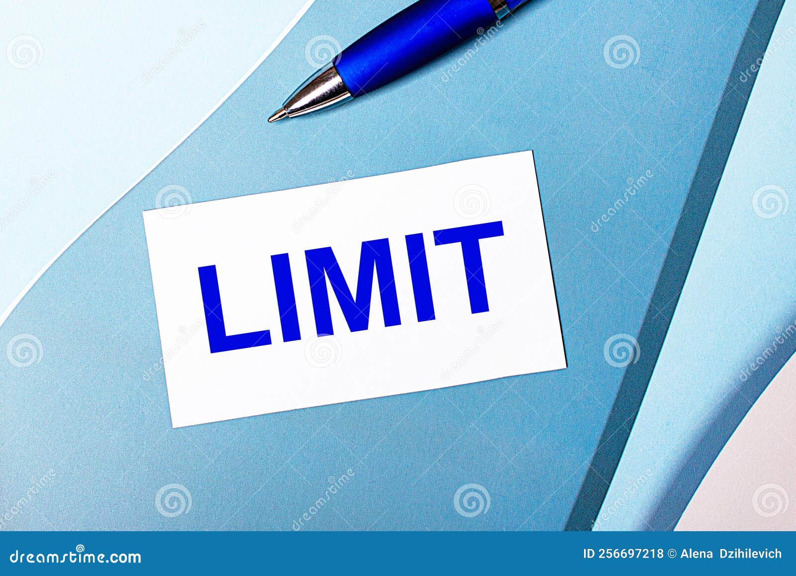 White Blank Card with LIMIT Text and Blue Pen on Blue, Cyan and Pink ...